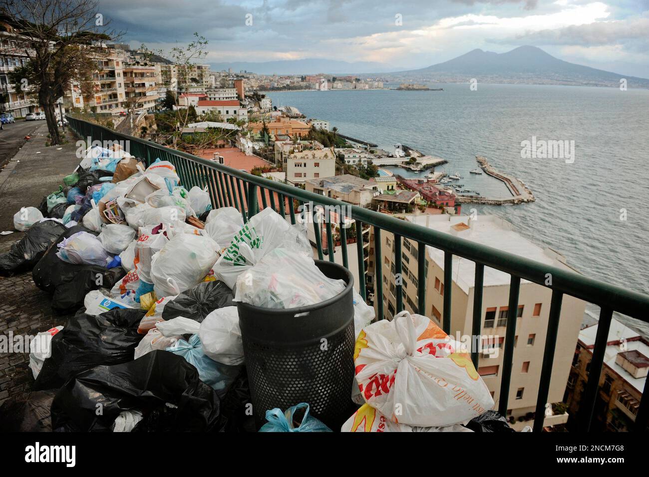 Uncollected trash is piled up on a sidewalk in Naples, Italy, Monday ...