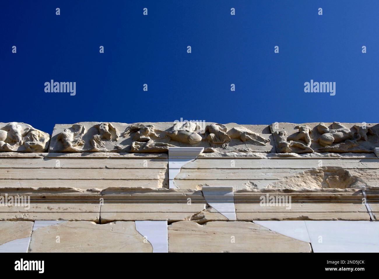 A copy of the original sculptured frieze is seen on the elegant marble ...
