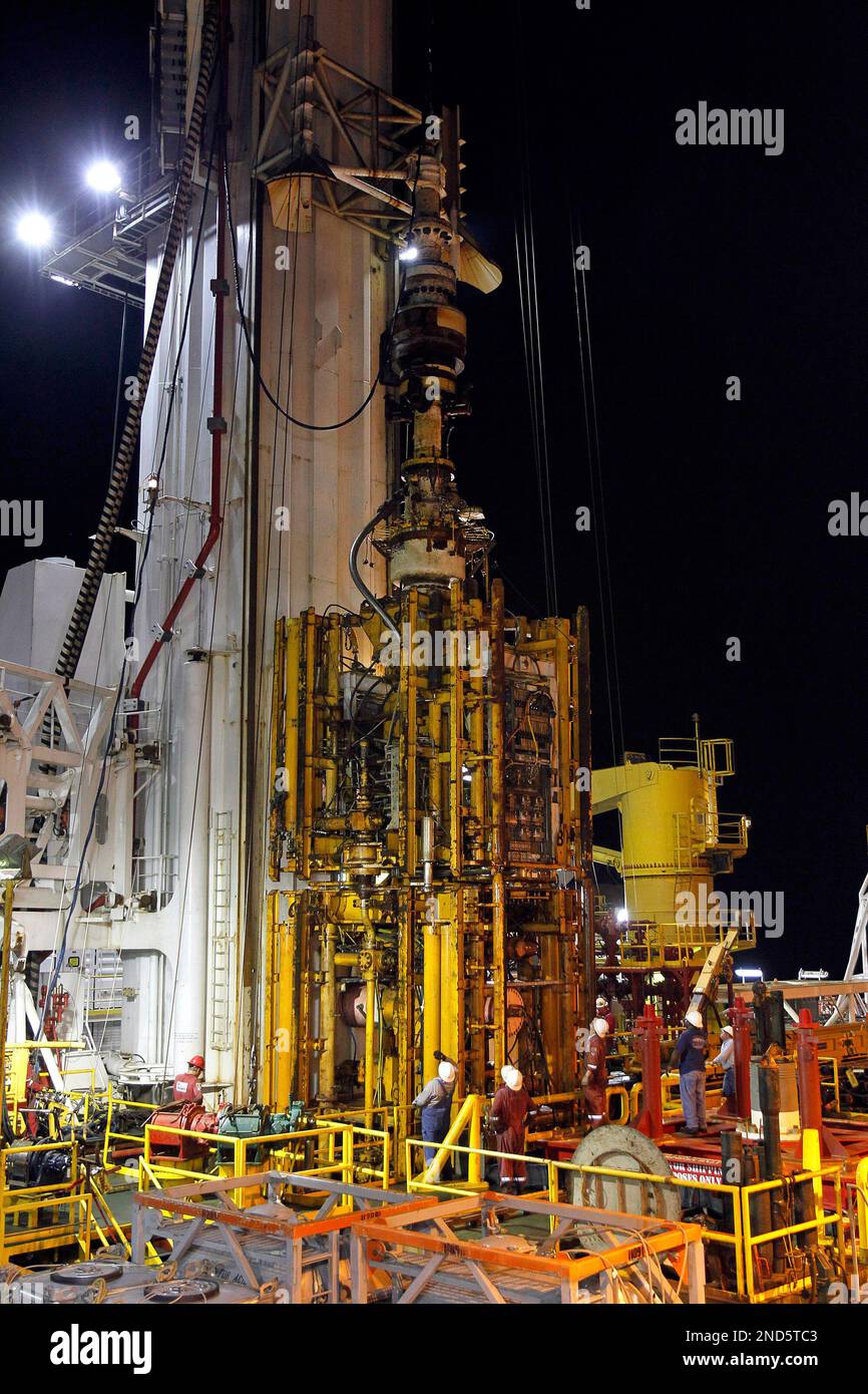 Workers Watch As The Deepwater Horizon Blowout Preventer Stack Is