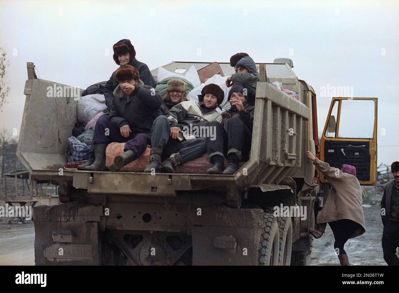 Refugees leaving the embattled Chechen capital Grozny are piled into ...