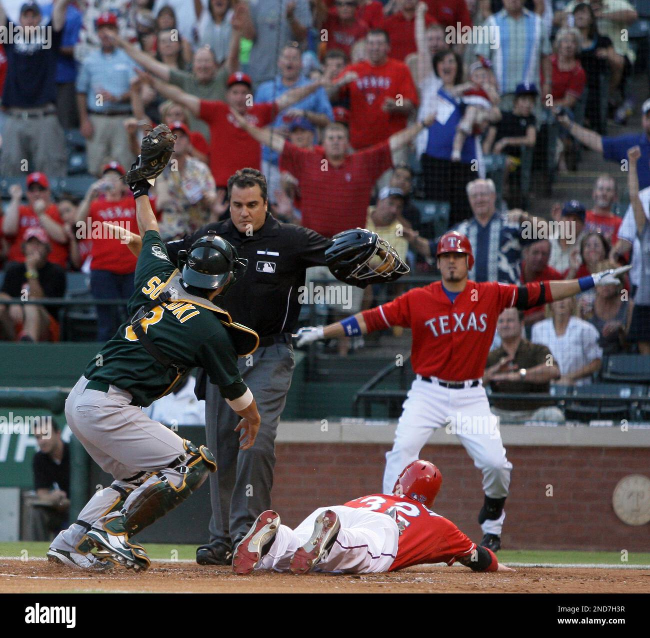 Oakland Athletics catcher Kurt Suzuki (8) and Texas Rangers' Josh ...