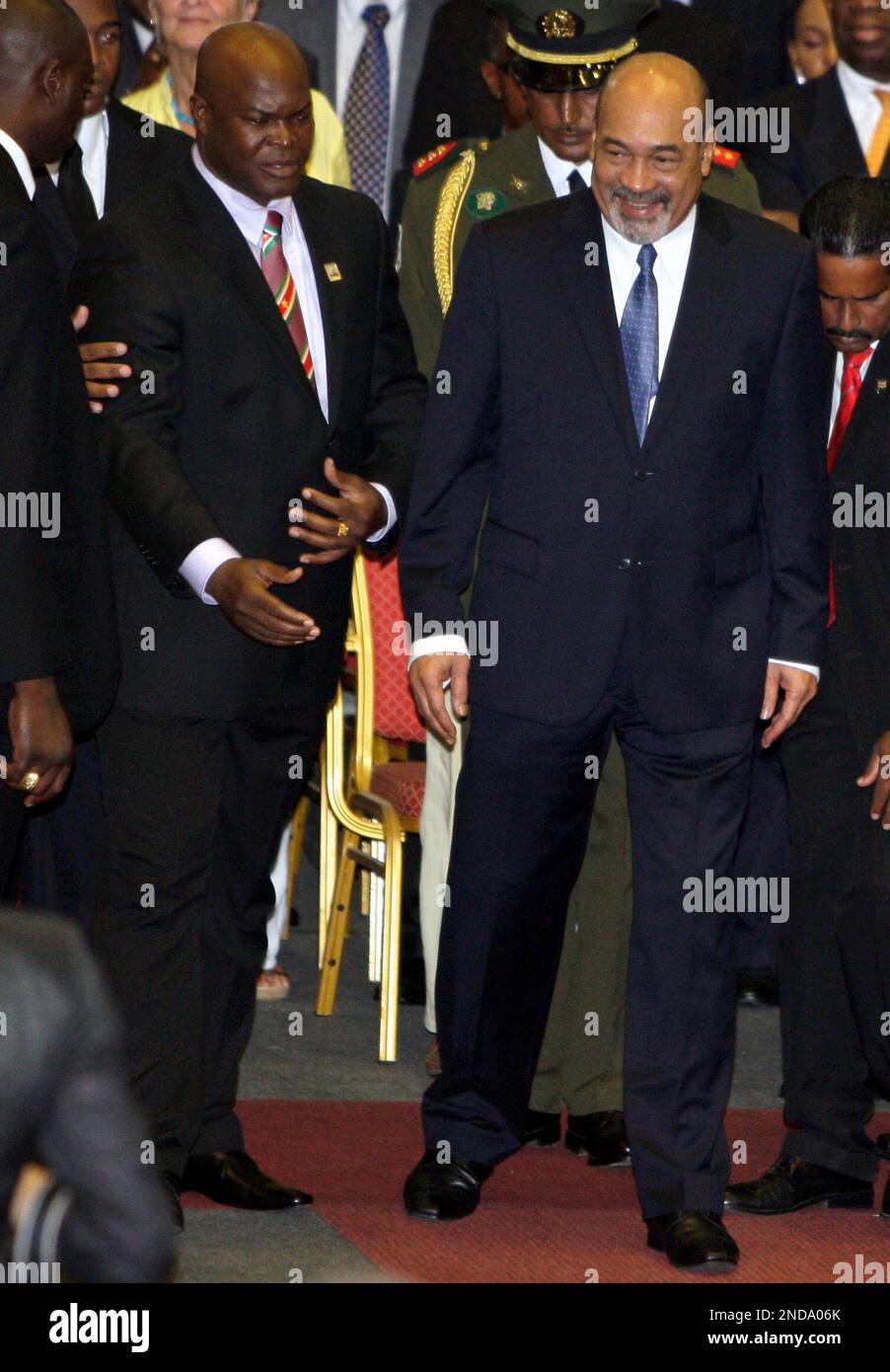 Suriname's President Desi Bouterse, right, arrives to his inauguration ...