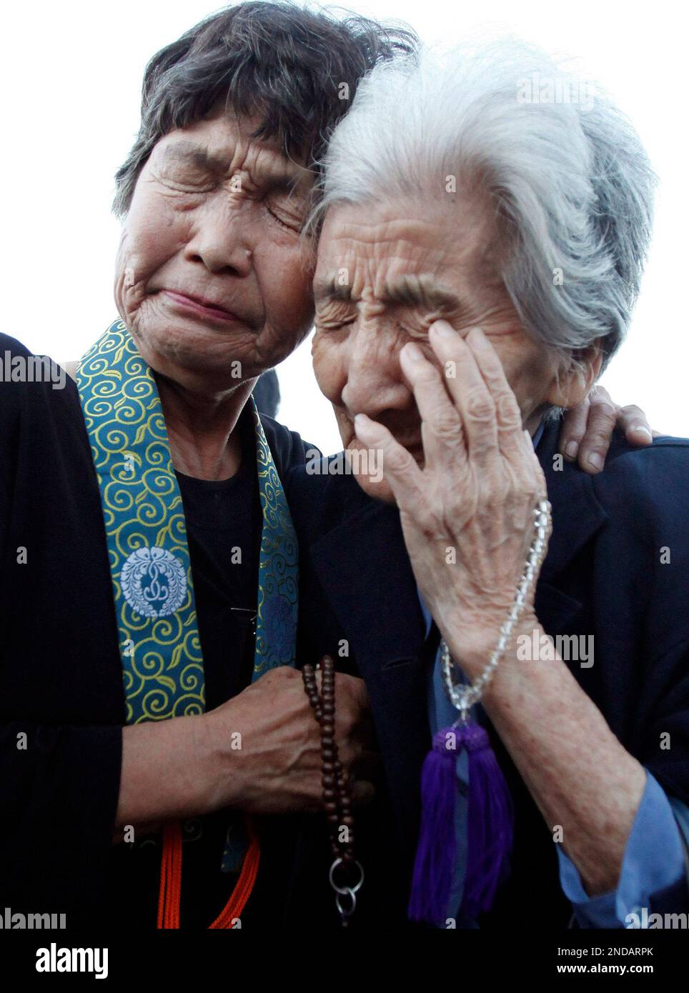 Tsuyuko Nakao, 92, right, and Kinuyo Ikegami, 77, both bereaved family ...