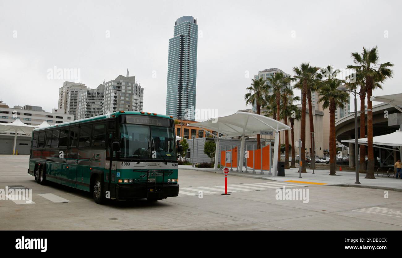 An AC Transit bus makes its way through the Transbay Temporary Terminal ...