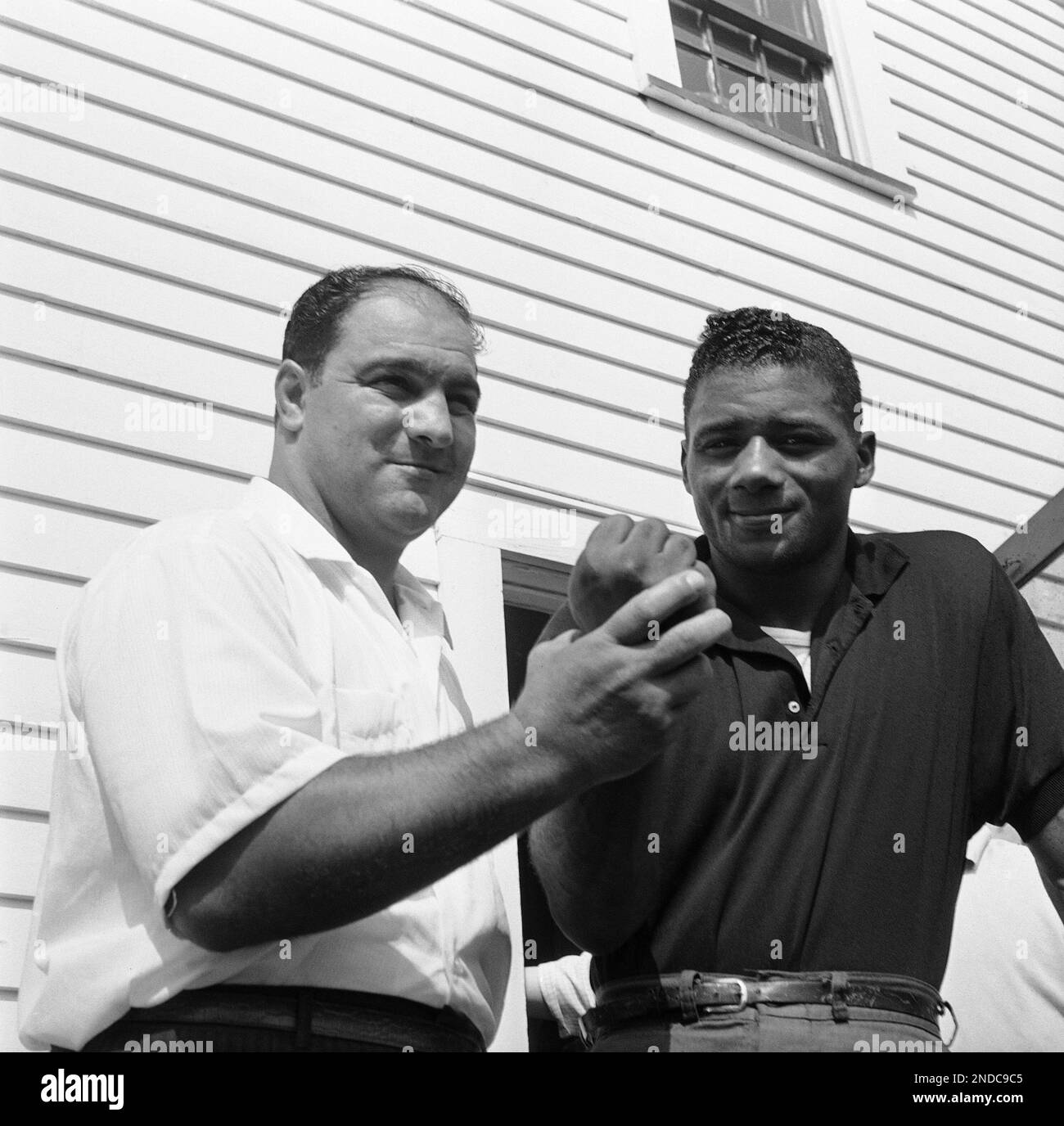 Rocky Marciano, former World Heavyweight Boxing Champion, holds fist of ...