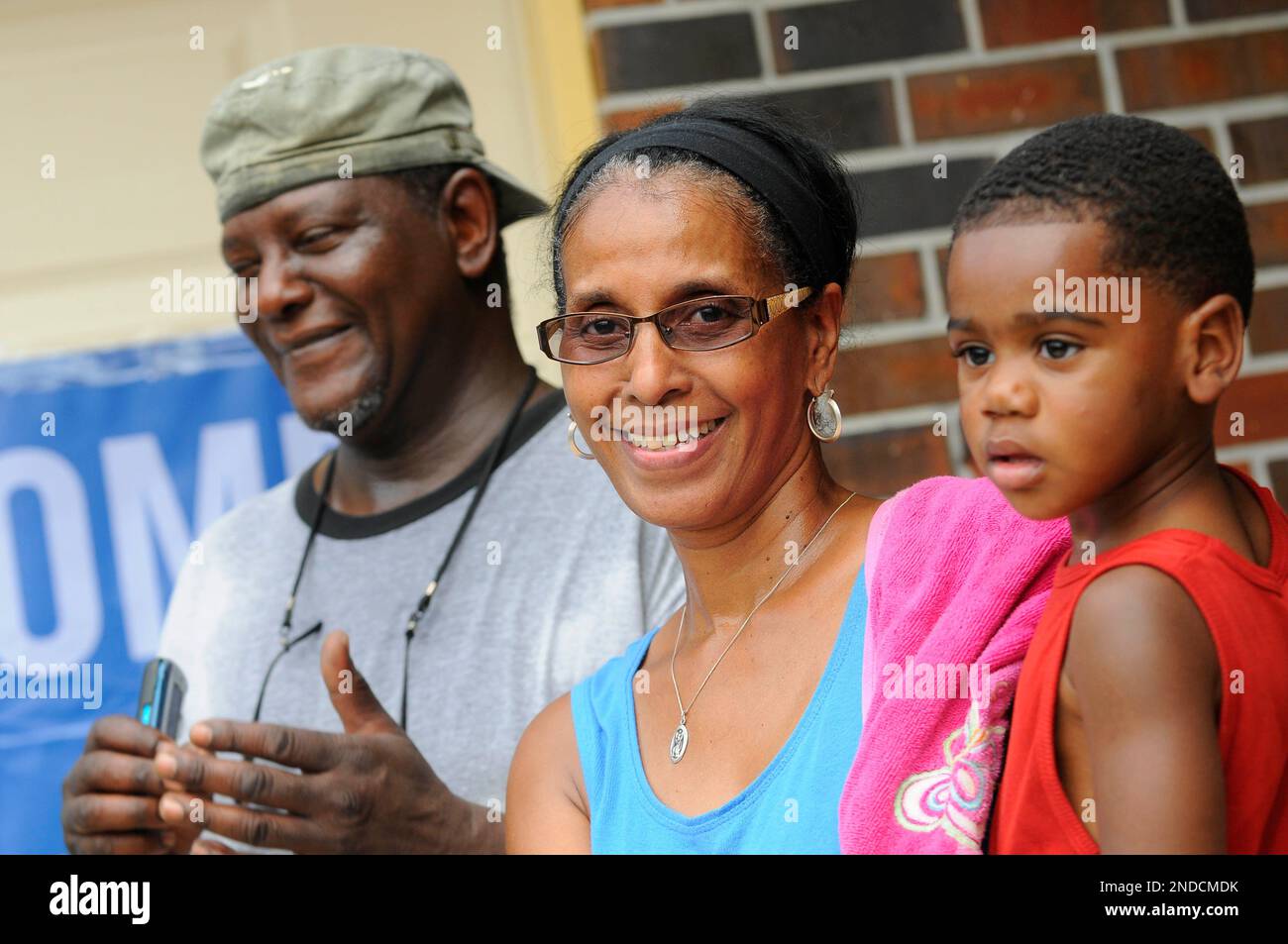 Homeowners Vernon and Royce Treaudo with their two-year-old grandson ...