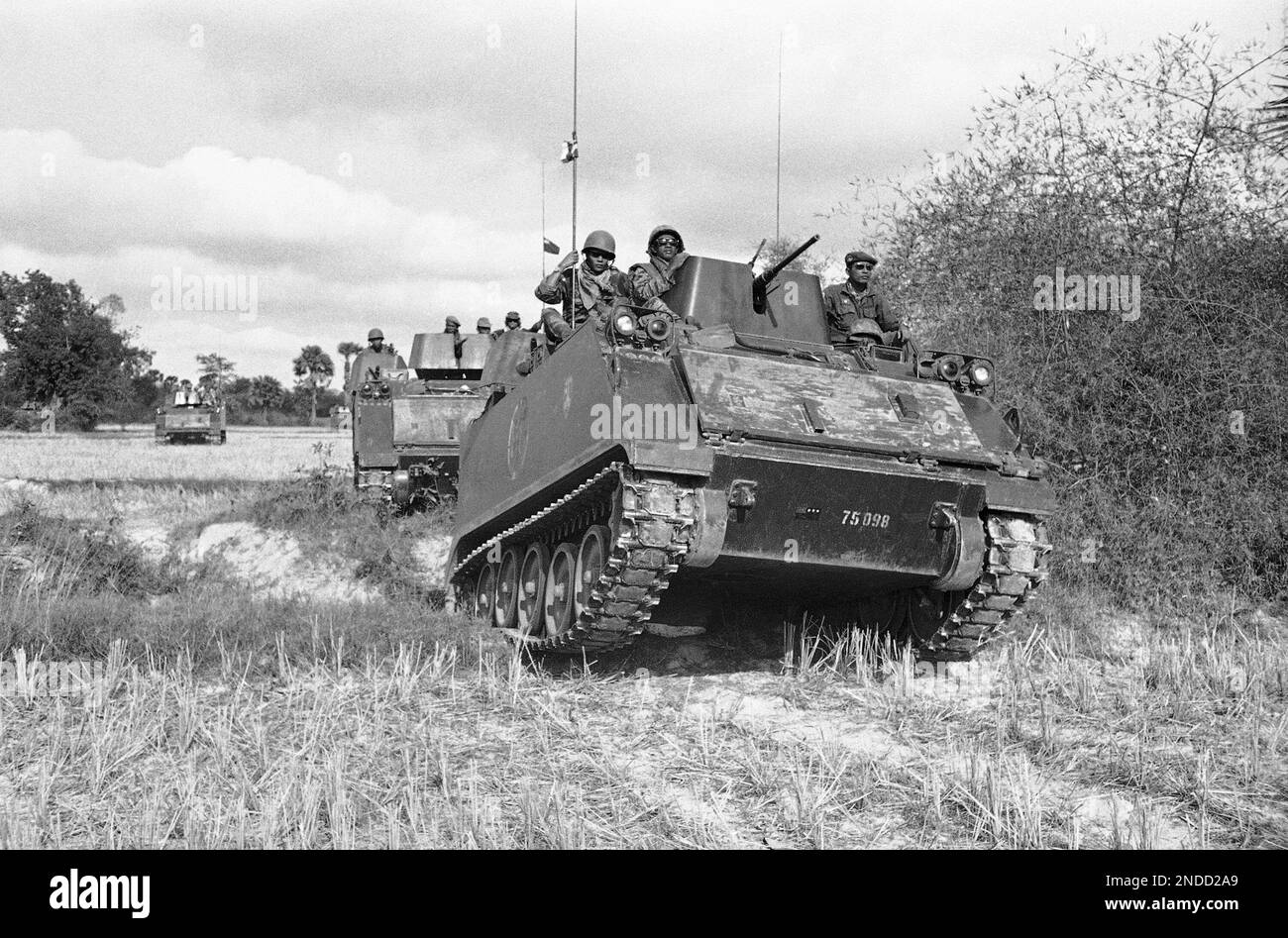 Cambodian army armored personnel carrier unit moves through dry rice ...