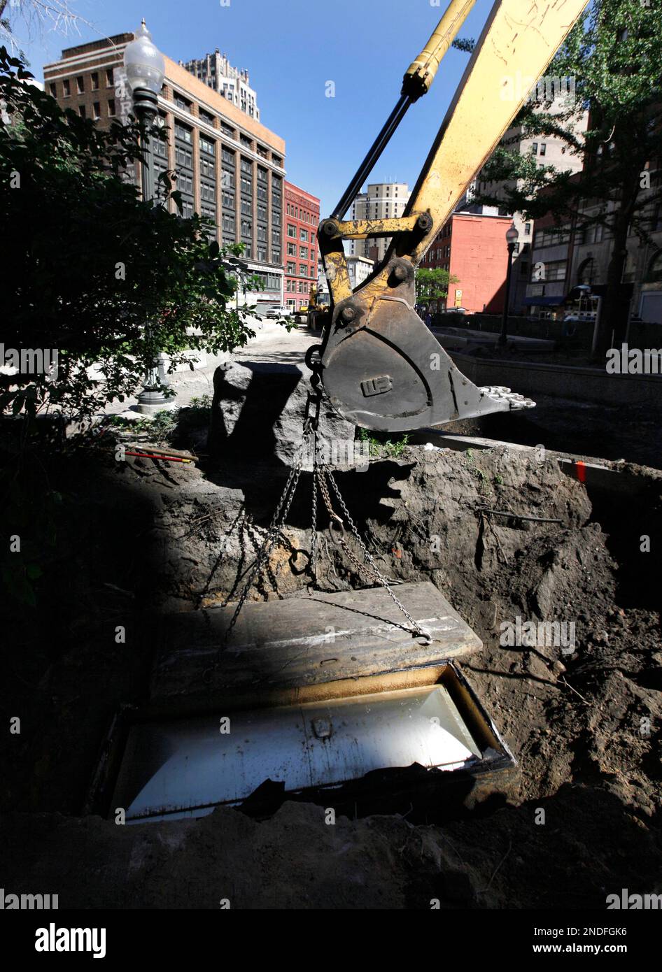 Work crews expose the casket of Michigan's first governor, Stevens T ...