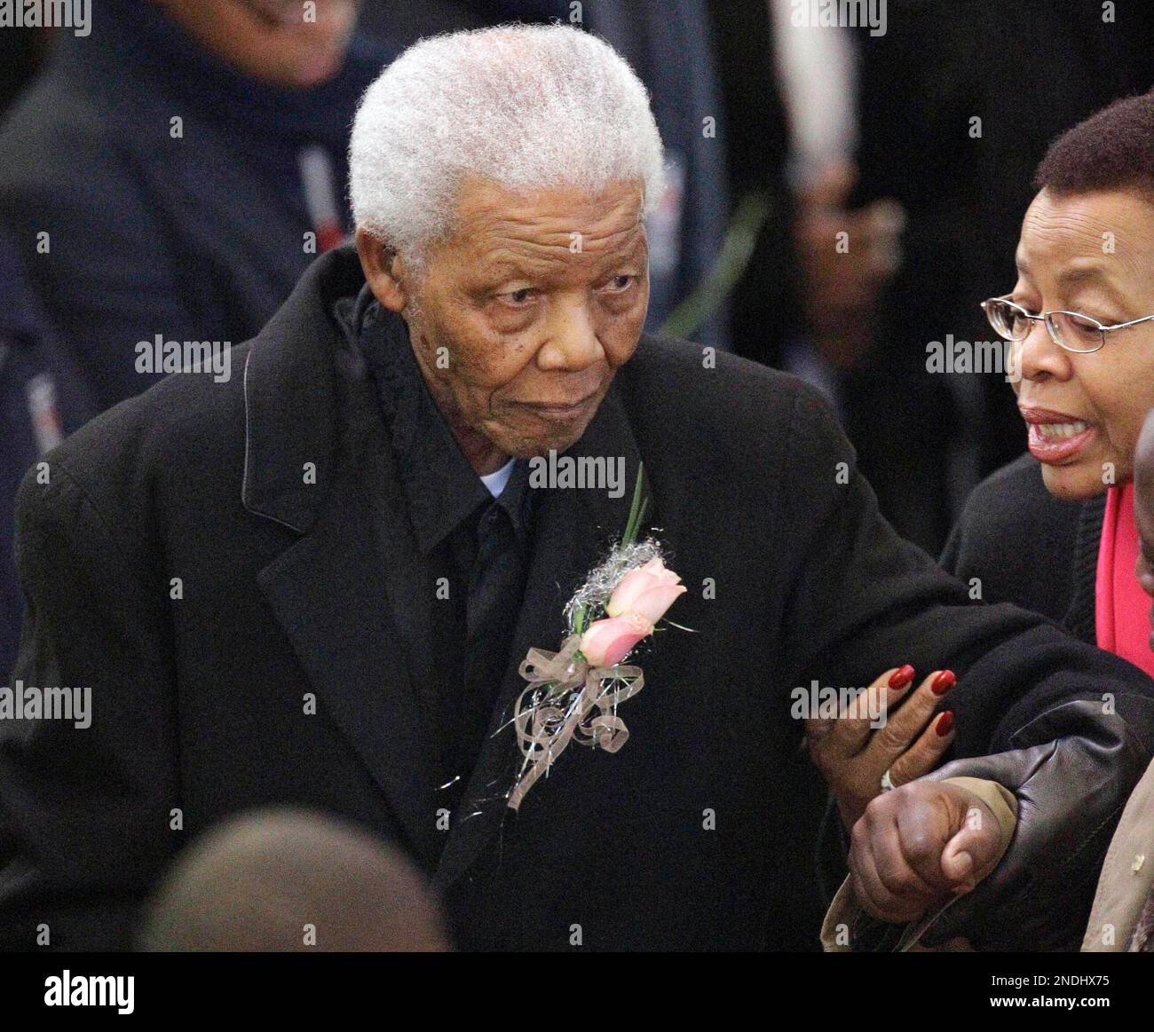 Former South African Former President Nelson Mandela is led by his wife ...