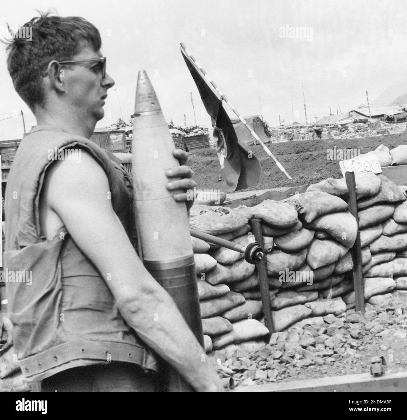 U.S. marine bunker carries a 155MM shell to gun during an artillery ...