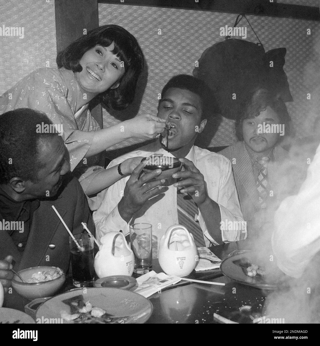 Muhammad Ali is served by a waitress named Koko in a Japanese ...