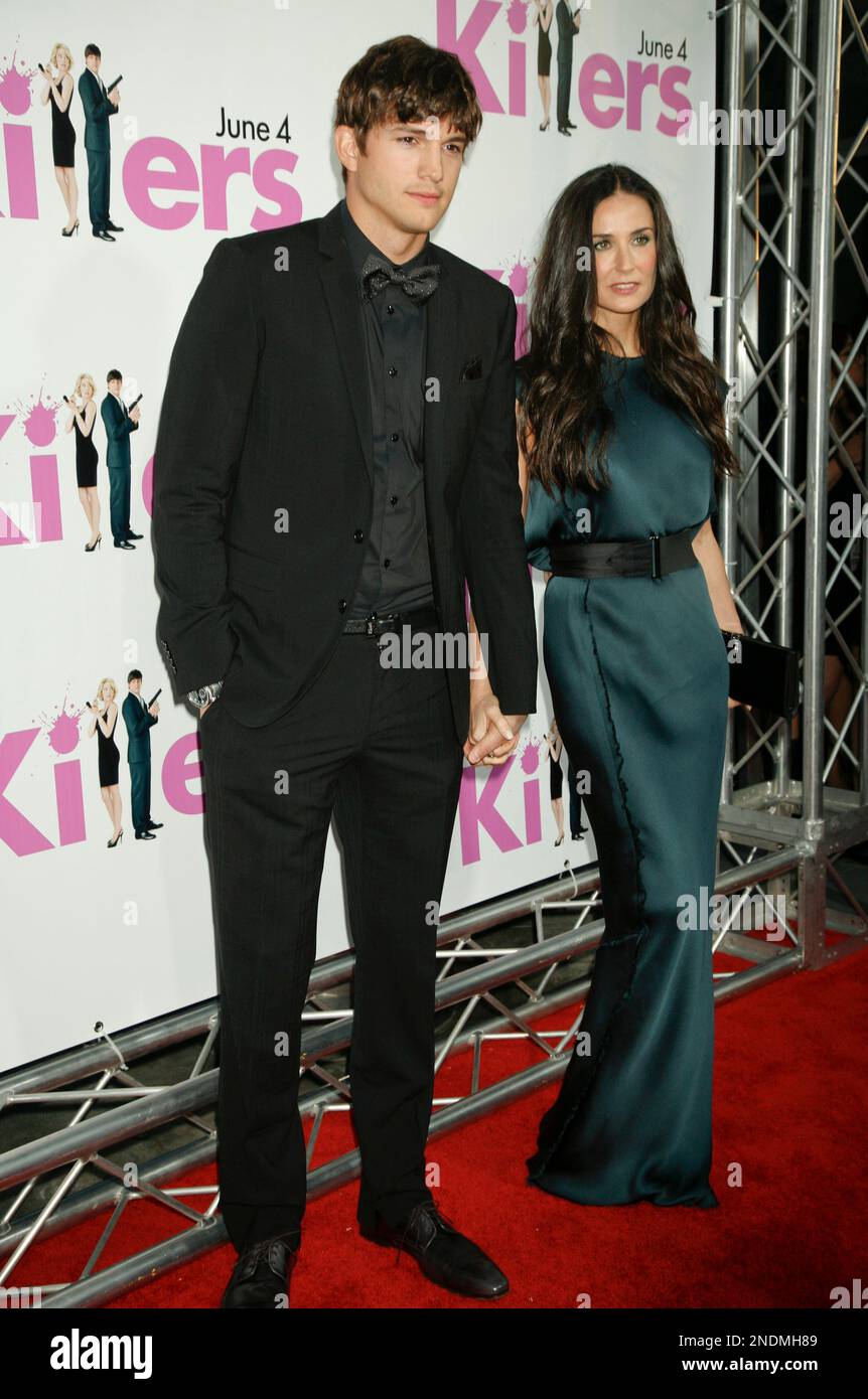 Actor Ashton Kutcher arrives with his wife, actress Demi Moore, at the ...
