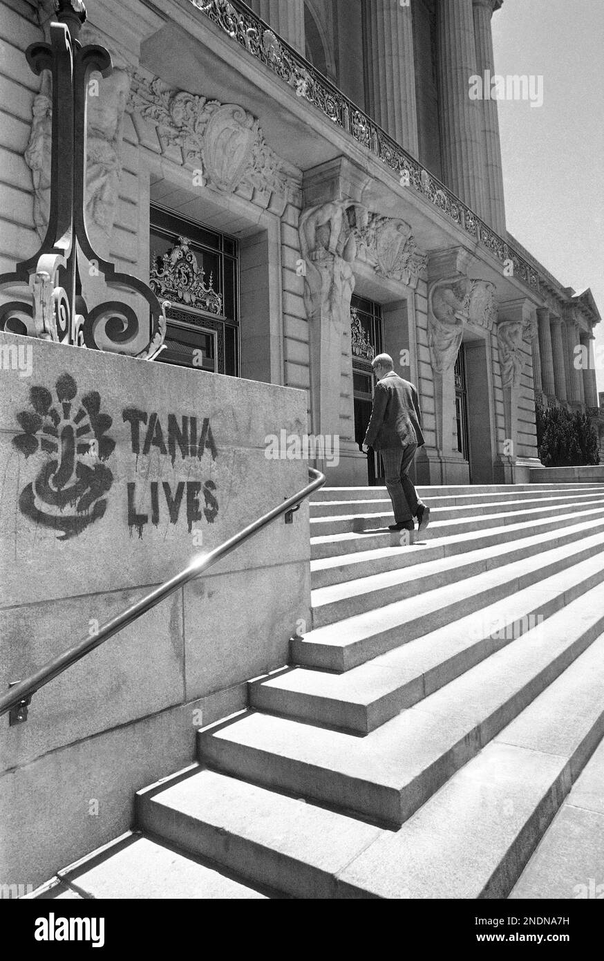 Stenciled in red paint the slogan “Tania Lives” and the seven-headed ...