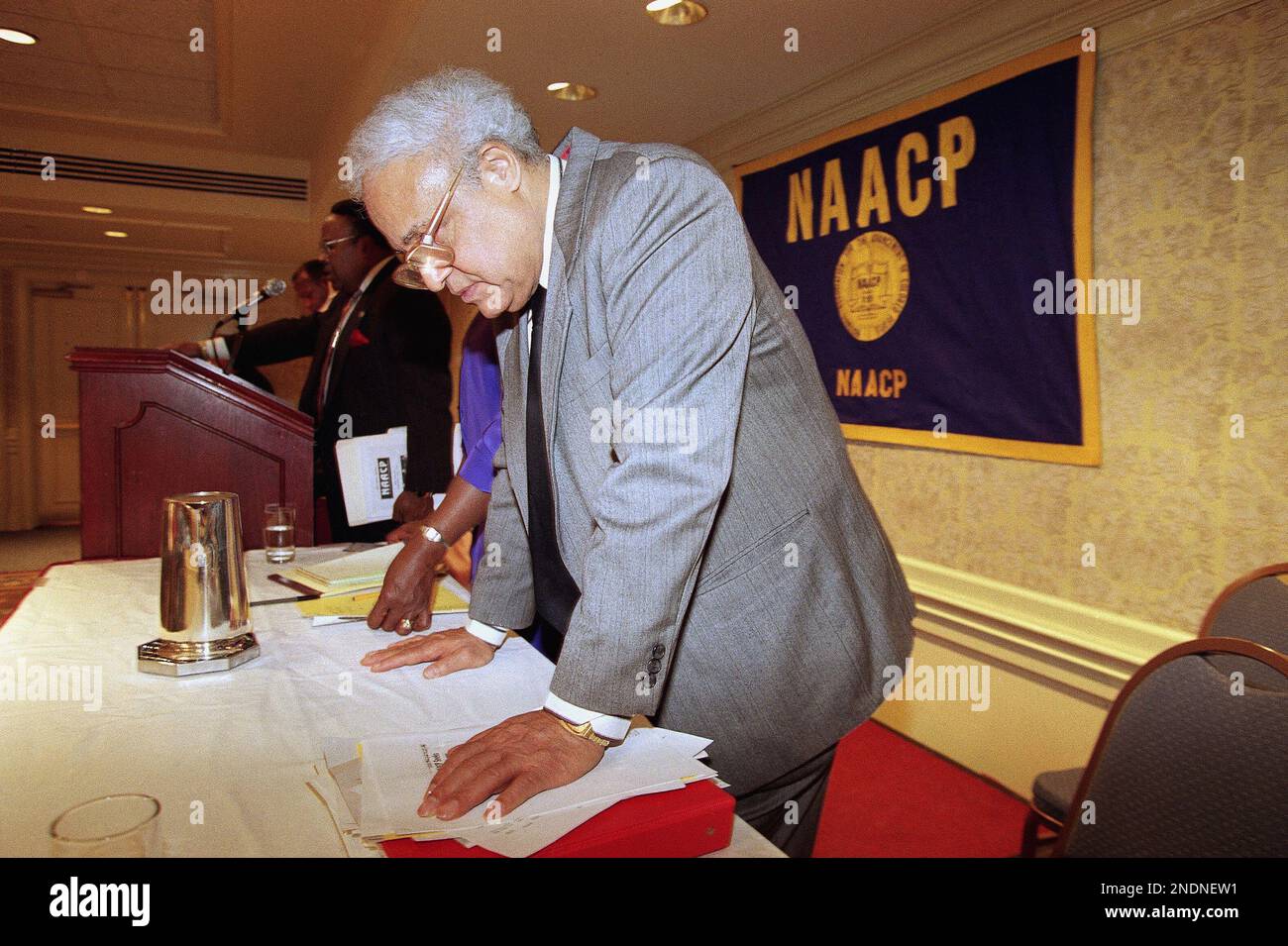 Dr. Benjamin Hooks, executive director and CEO of the NAACP, bows his head in prayer during the ...