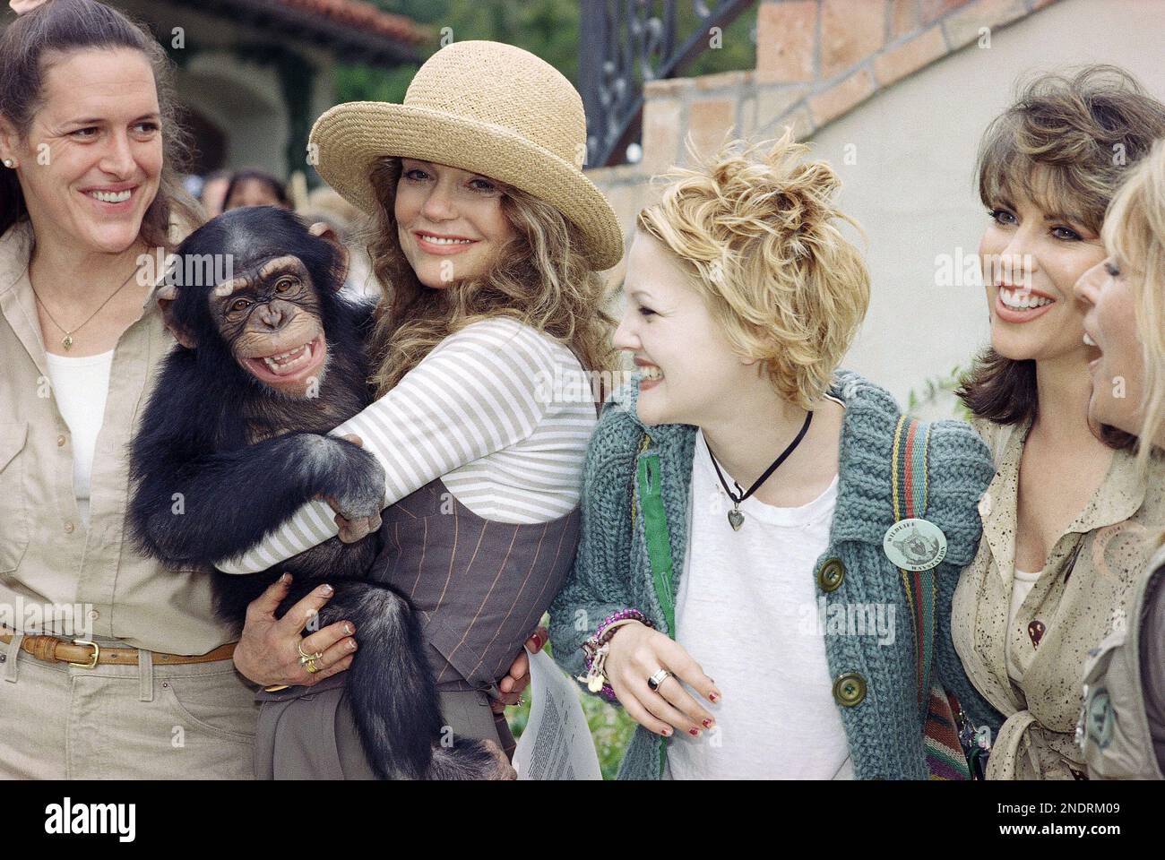 Actress Dyan Cannon, center, holds “Chubbs” while Kathy Riordan, left ...