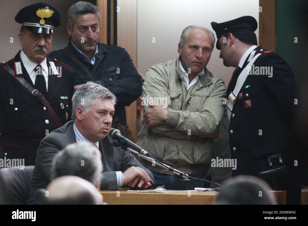 Chelsea soccer team coach Carlo Ancelotti, bottom left, looks on as he ...