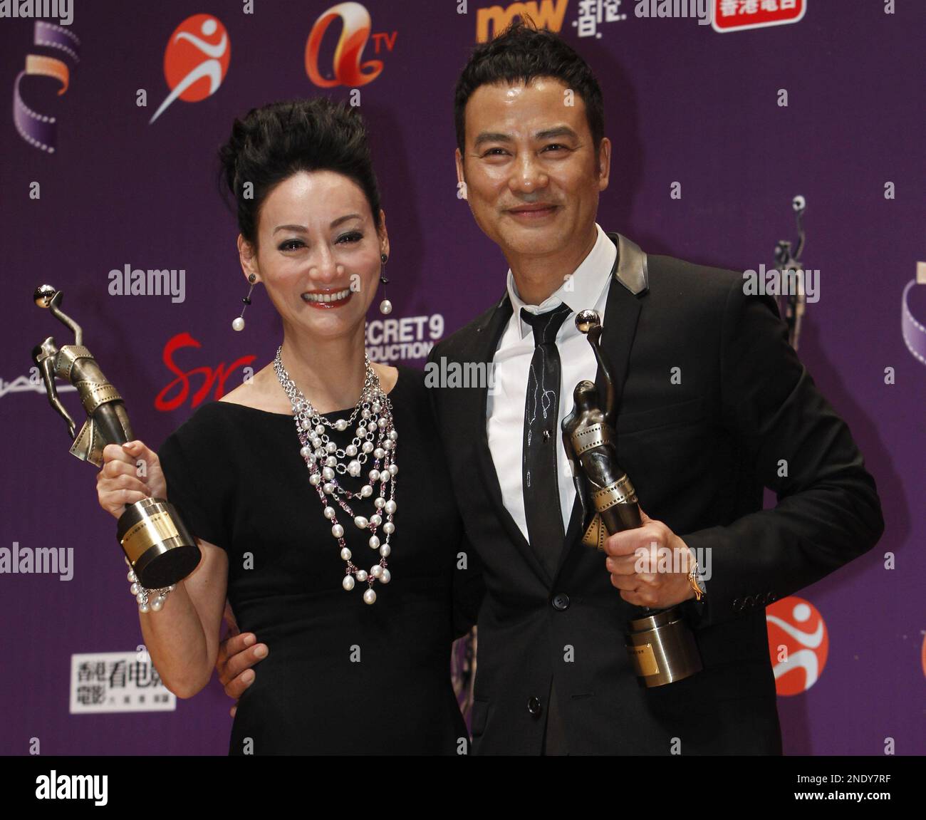 Hong Kong actress Wai Yin Hung, left, and actor Simon Yam celebrate ...
