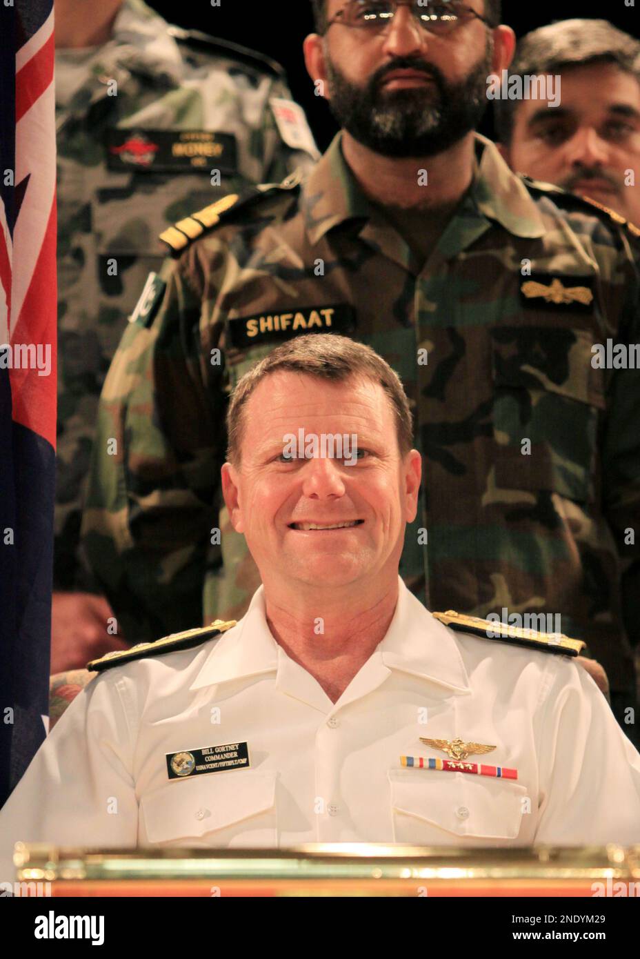 U.S. Vice Admiral William Gortney sits with members of a multinational ...