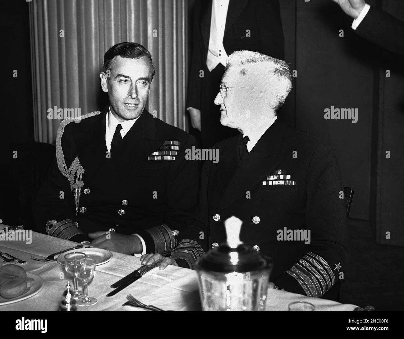 Britain's Lord Louis Mountbatten British Combined Operations chief, left, talks with Admiral ...