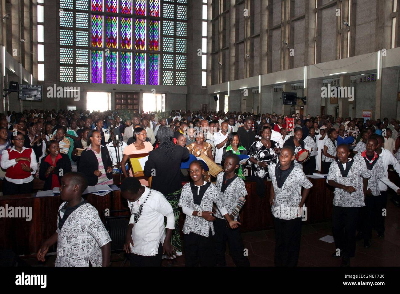 Kenyan Christian sing and praise the Lord as they join a morning ...