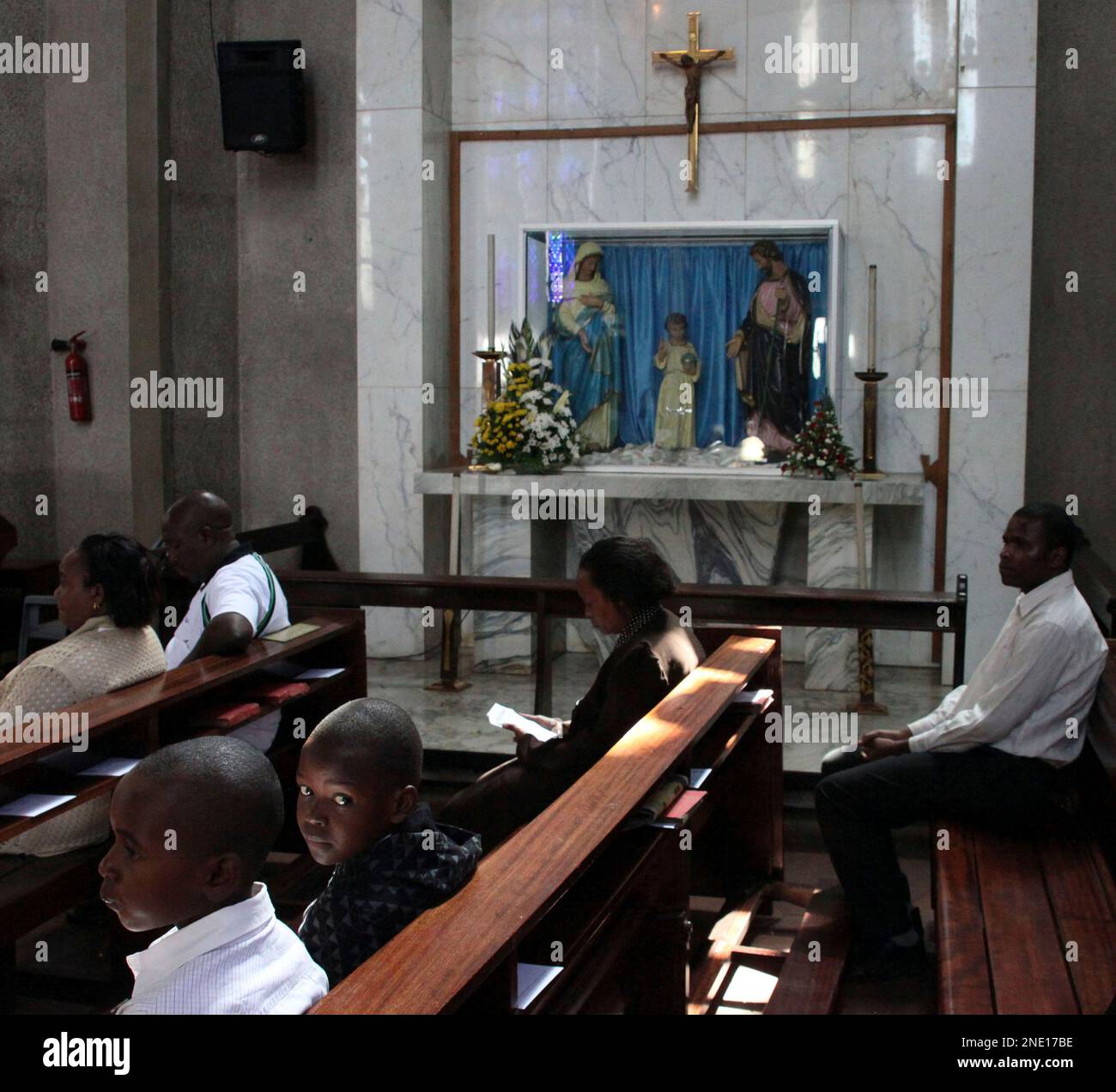 Kenyan Christian as they join a morning service at Holy Family Basilica ...