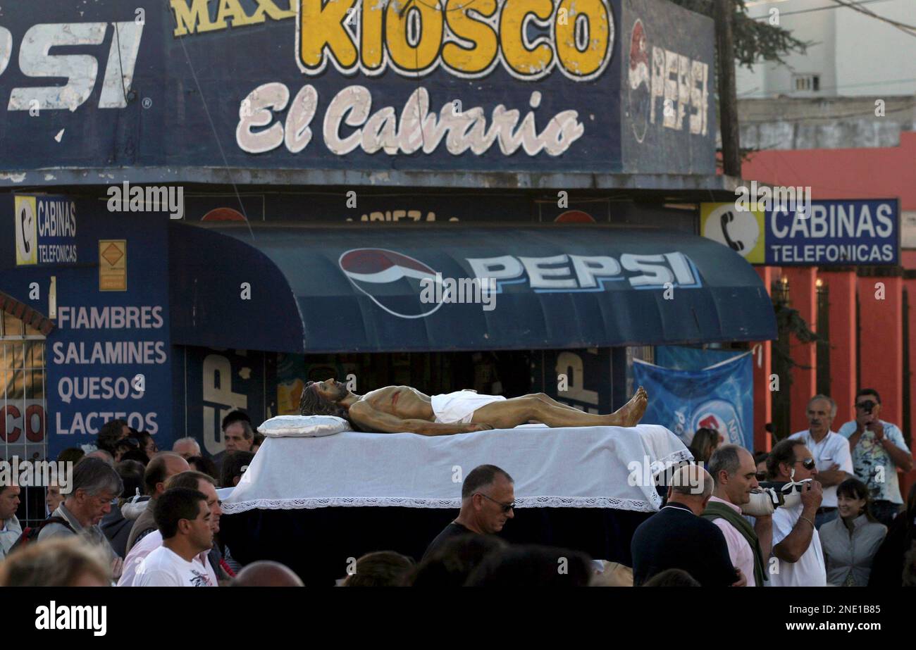 Catholics carry a statue of Jesus Christ during a Holy Week procession ...