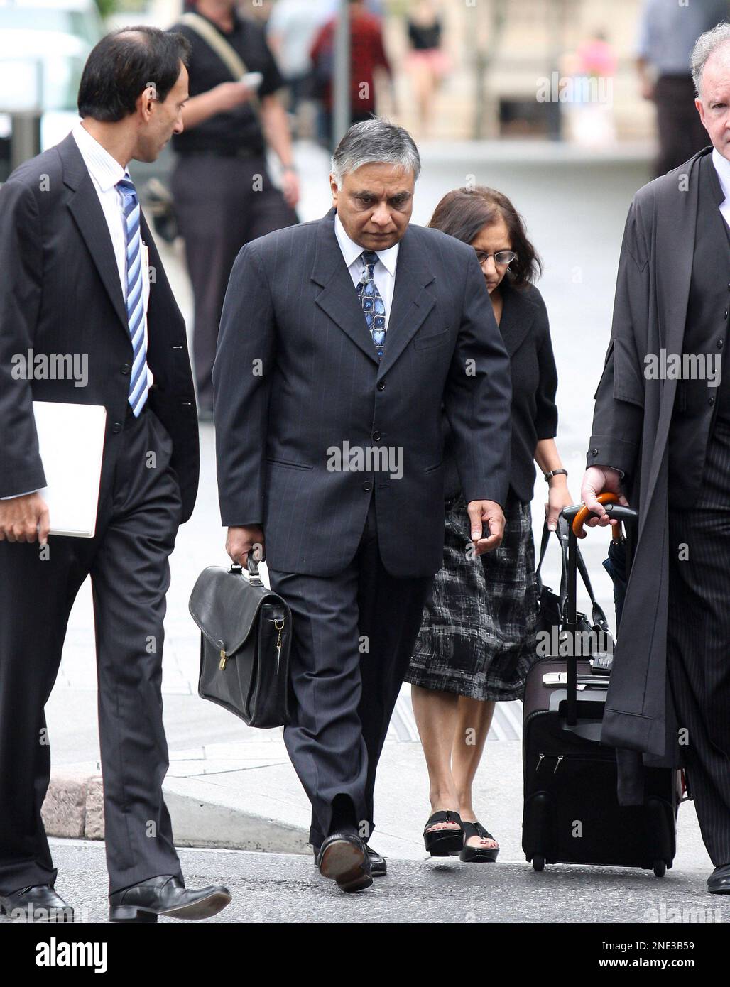 Dr. Jayant Patel, center, arrives at the Supreme Court with his wife ...