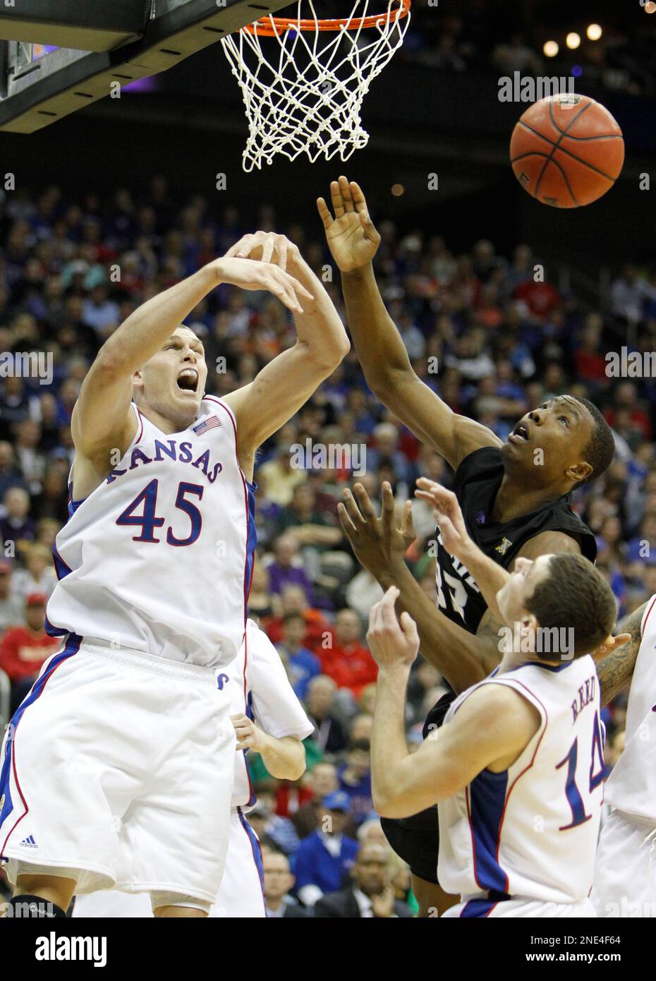 Kansas State guard Rodney McGruder shoots over Kansas' Cole Aldrich ...