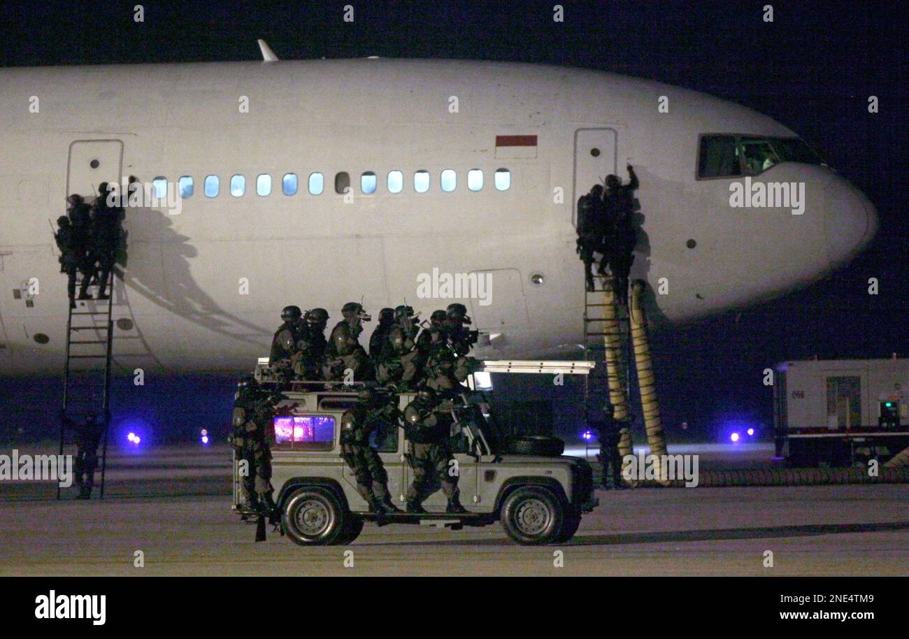 Indonesian Air Force Commandos of Detachment 'Bravo' drive past as ...
