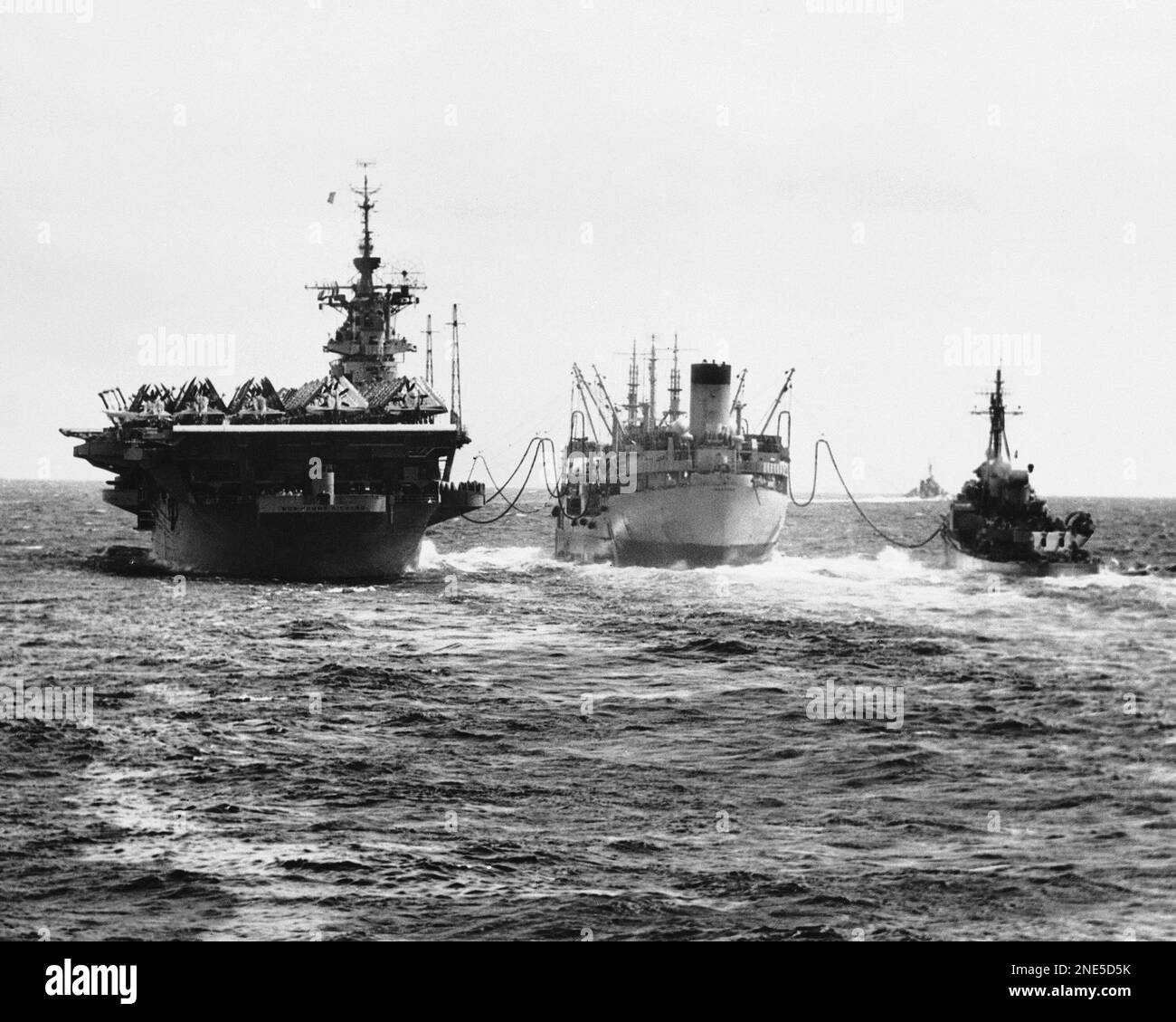 Oiler USS Manatee, center, does a big business as she pumps fuel oil ...