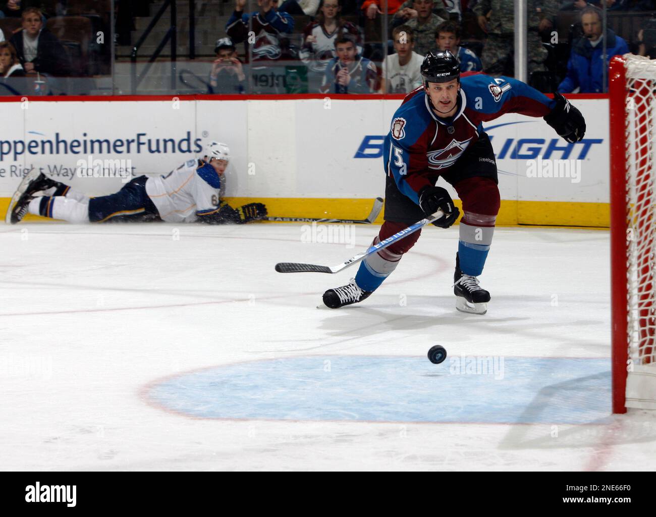 Colorado Avalanche center Matt Hendricks, front, rolls the puck in for ...