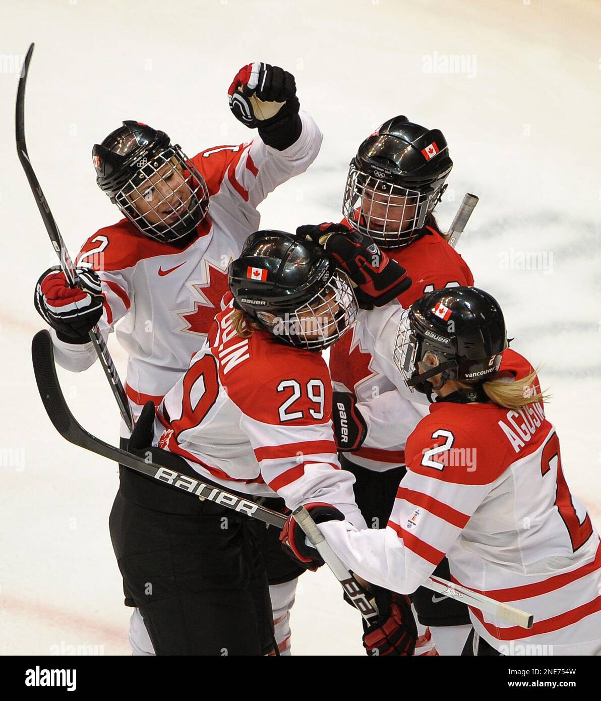 Canada's Meaghan Mikkelson, left to right, Marie-Philip Poulin ...