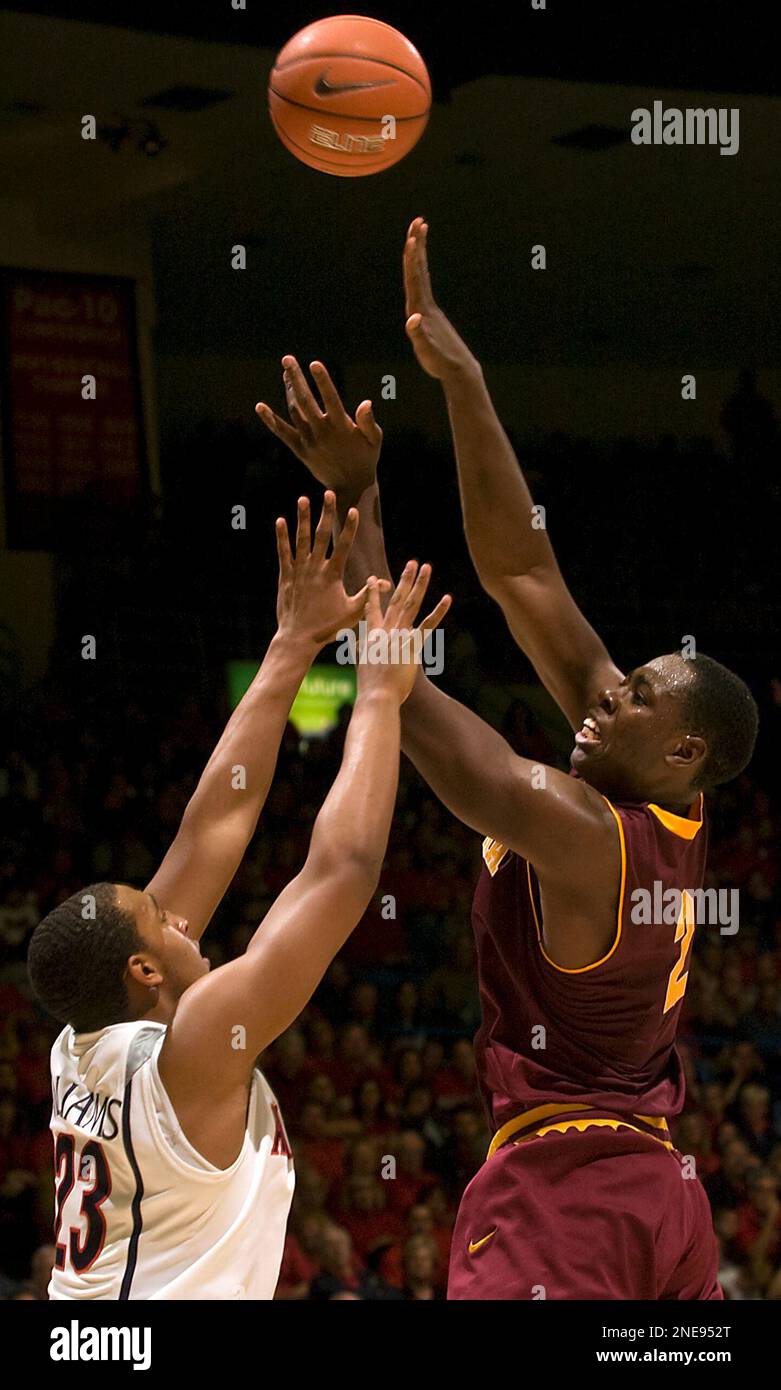 Arizona's State's Eric Boateng (2) shoots over the attempted defense of ...