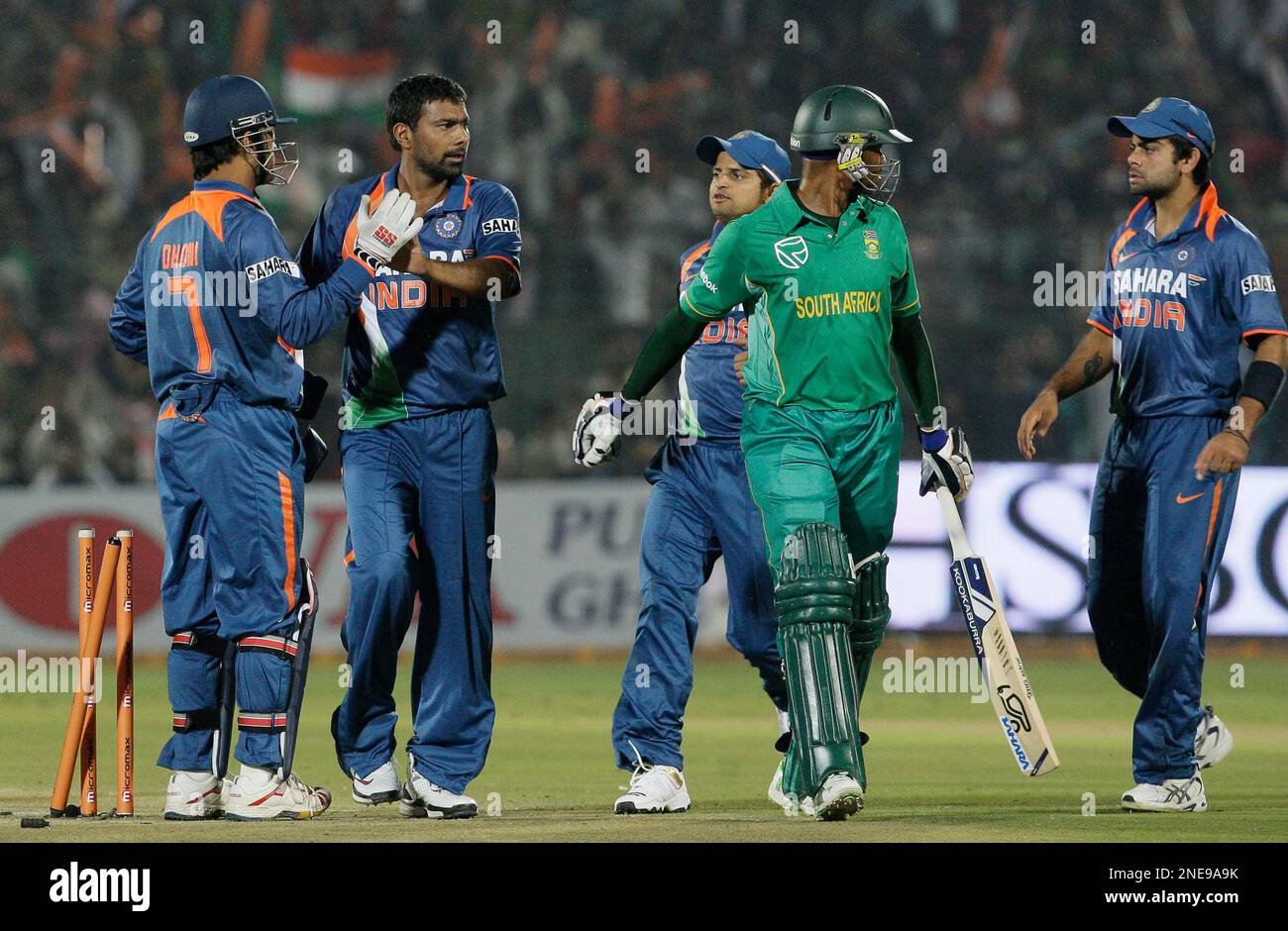 South Africa's batsman Loots Bosman, second right, walks from the ...