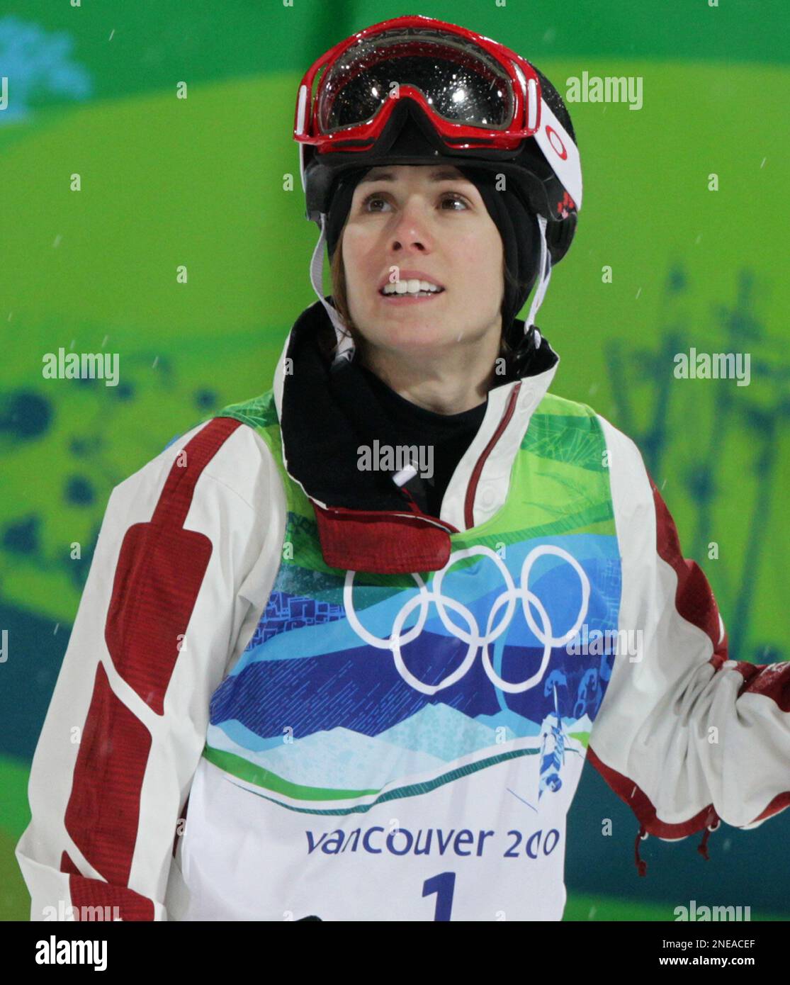 Canada's Jennifer Heil, left, of Spruce Grove, Alta., looks on after ...
