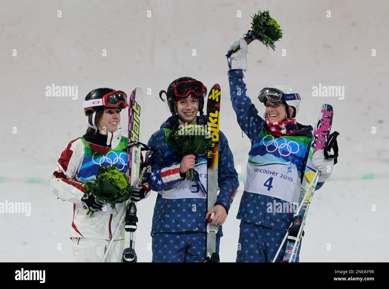 Olympic champion in women's moguls Hannah Kearney of the USA, center ...