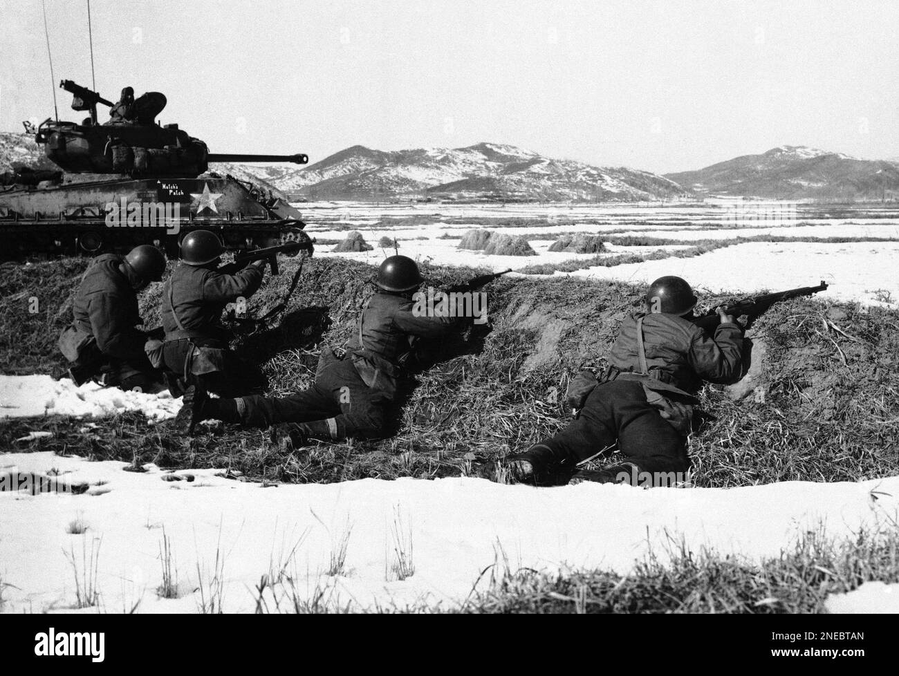M-4 tank of Co ?D? 89th Bn, 25inf. div supports elements of the Turkish Brigade as they attack ...