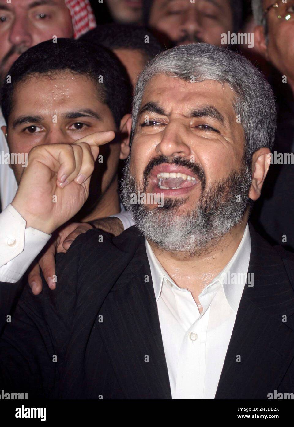 Hamas leader Khaled Mashaal speaks during the funeral procession of Mahmoud al-Mabhouh, one of ...