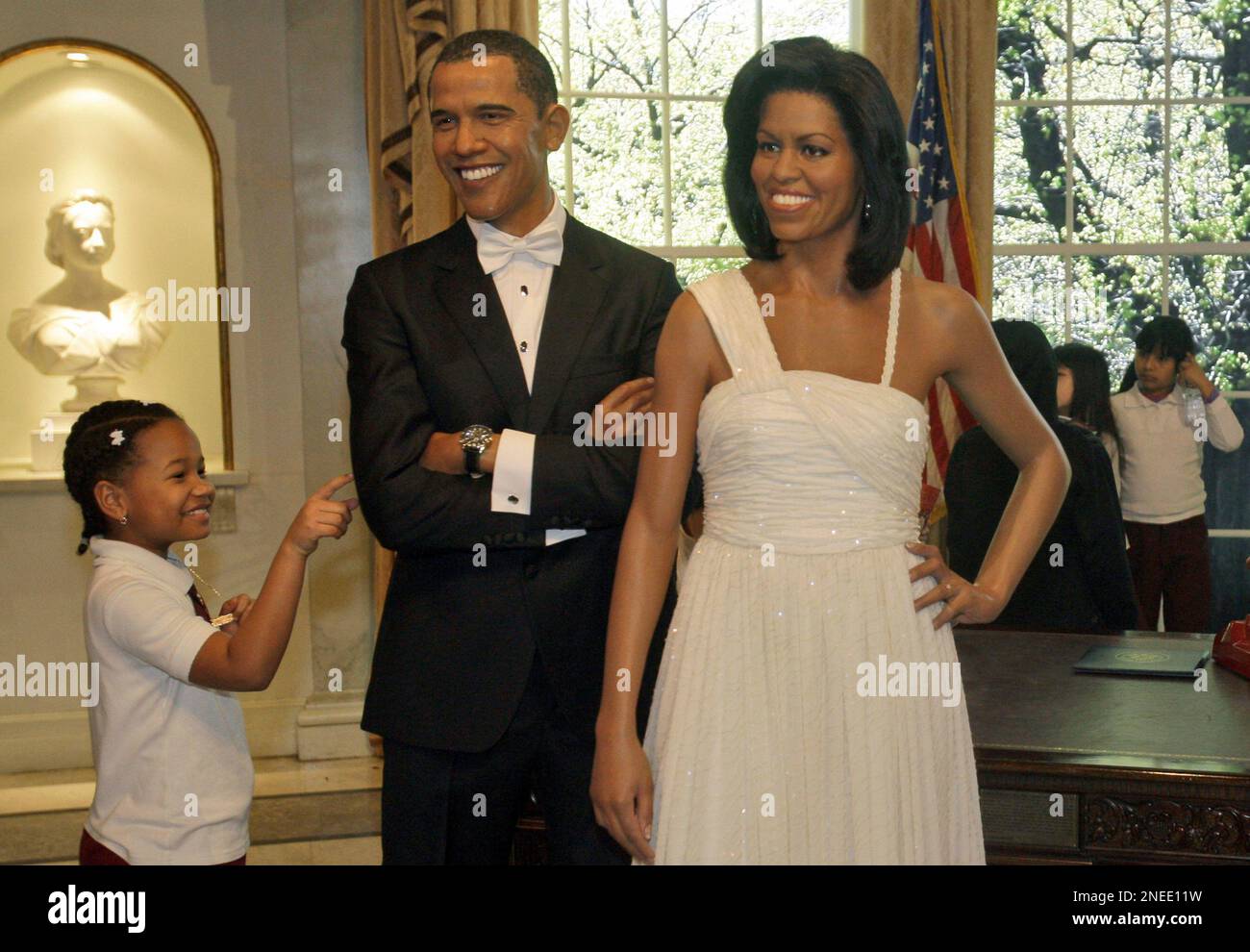 Elizinel Martinez, 9, of P.S. 192 touches a wax figure of President ...