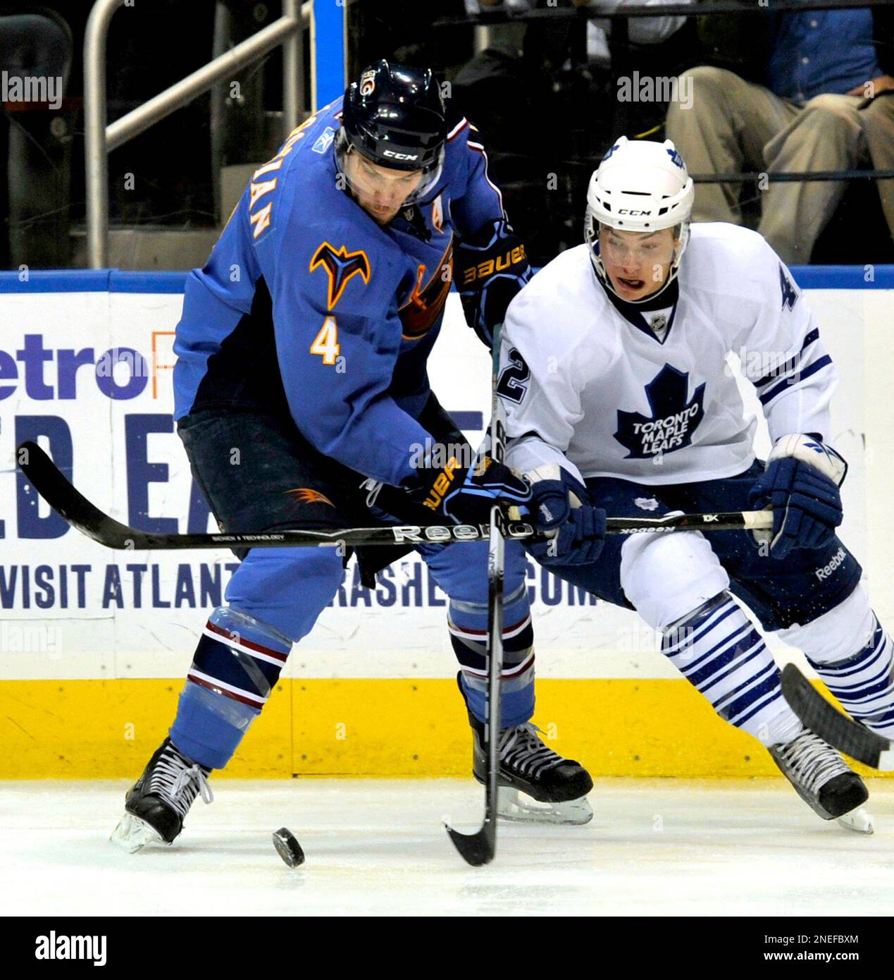 Atlanta Thrashers defenseman Zach Bogosian (4) fights for the puck ...