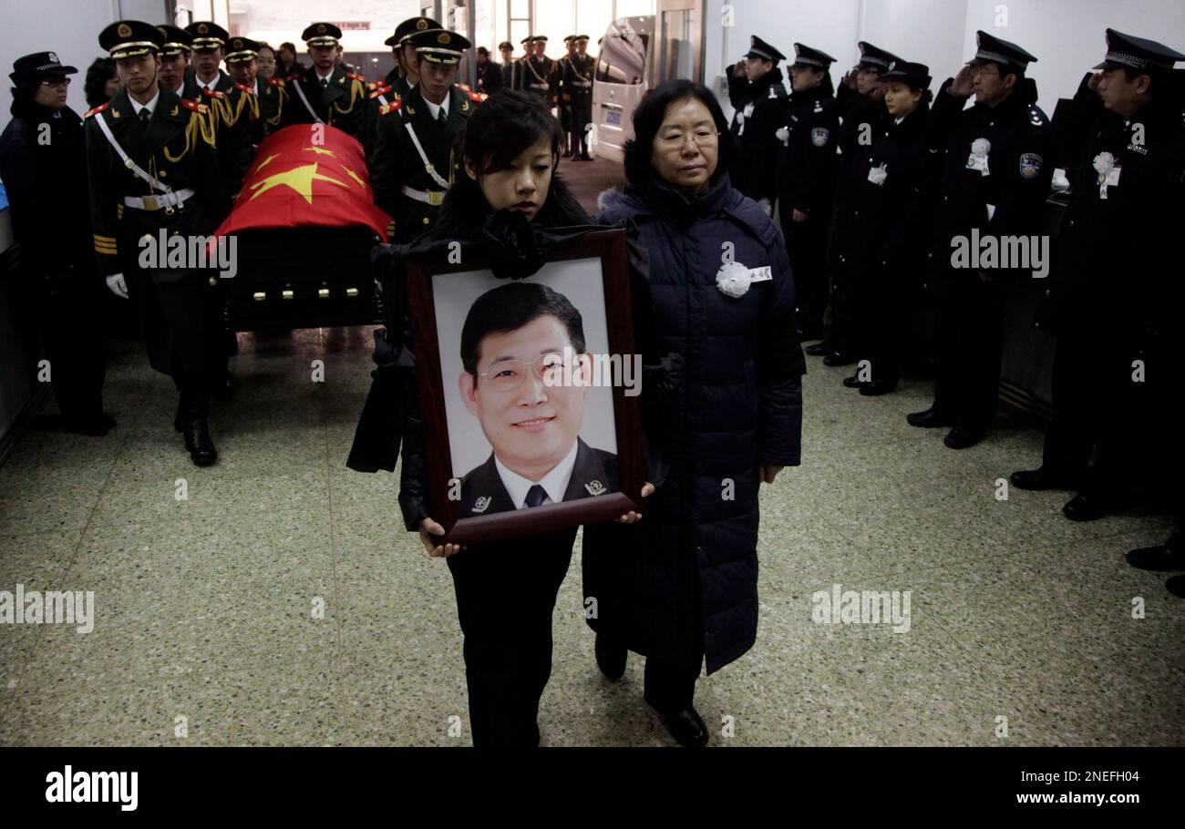 Relatives of Wang Shuling, one of the eight Chinese peacekeepers who ...