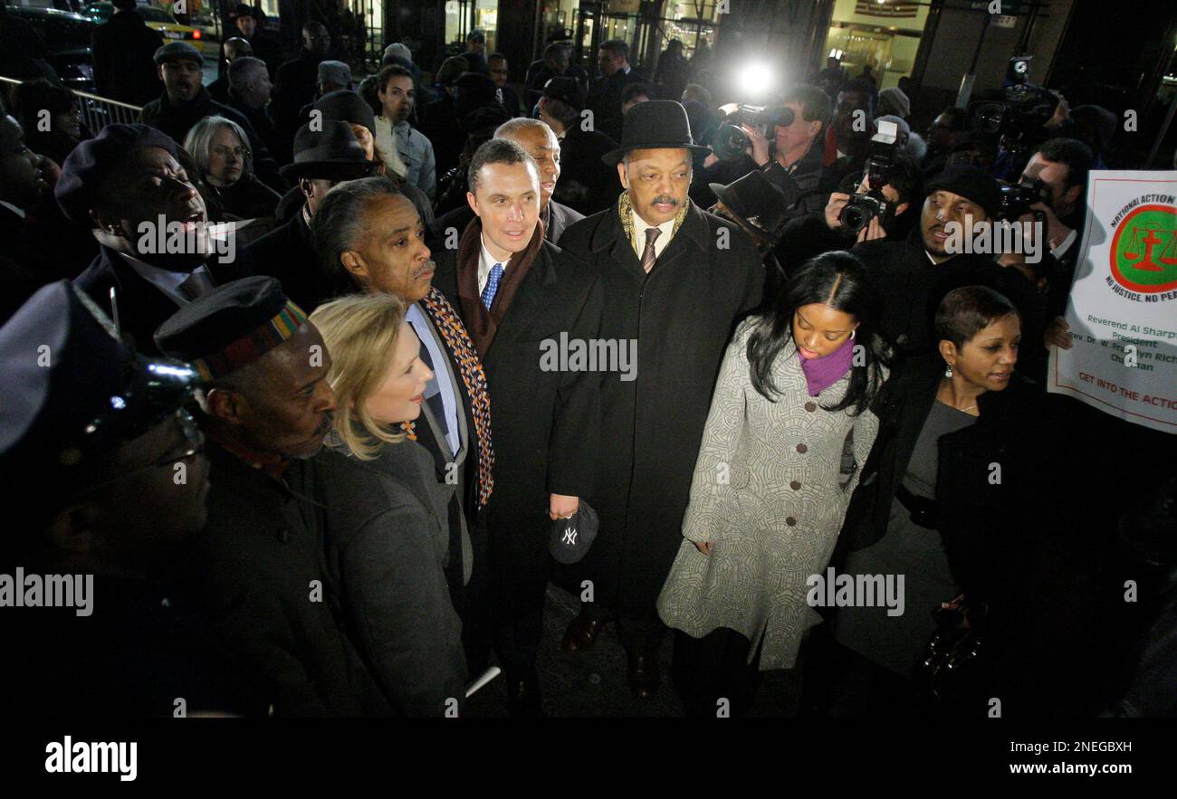 Rev. Al Sharpton, left, joins others in a vigil to pray for Hatian ...