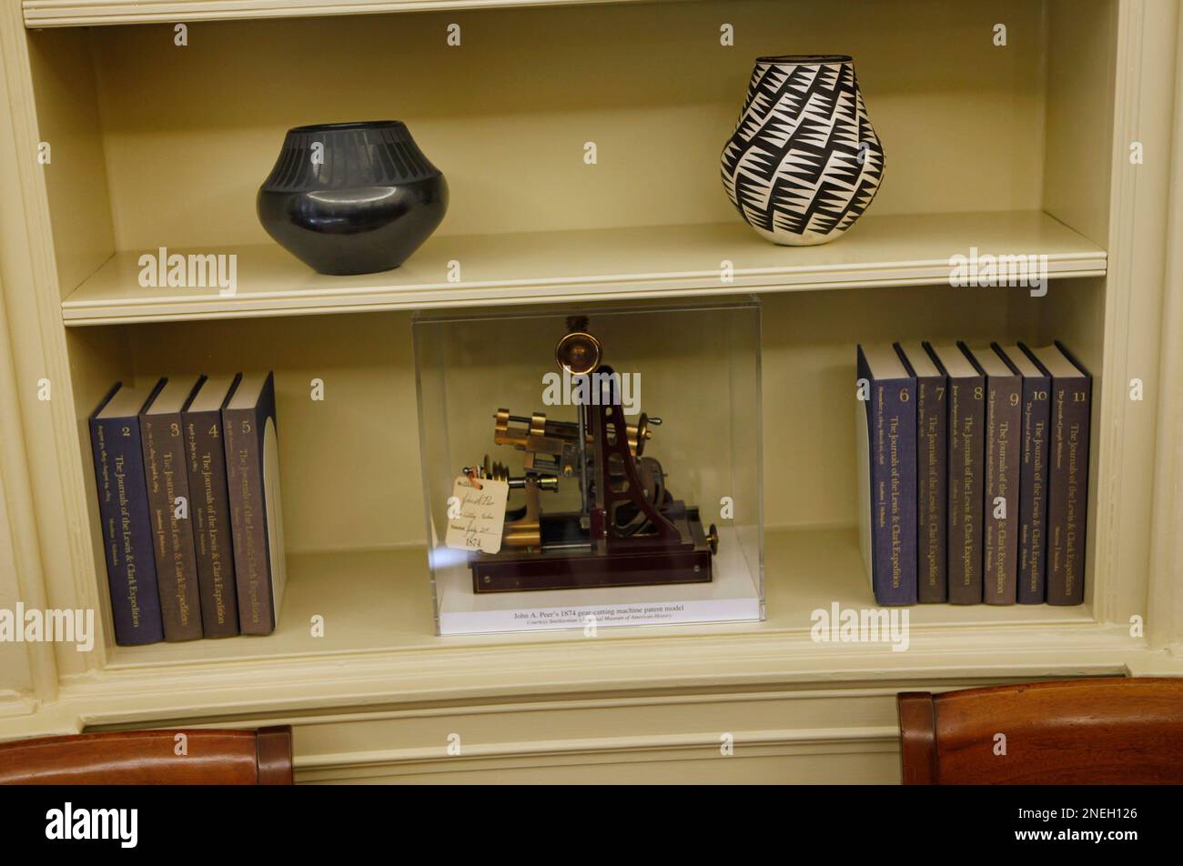 Items on shelves in the Oval Office of the White House in Washington ...