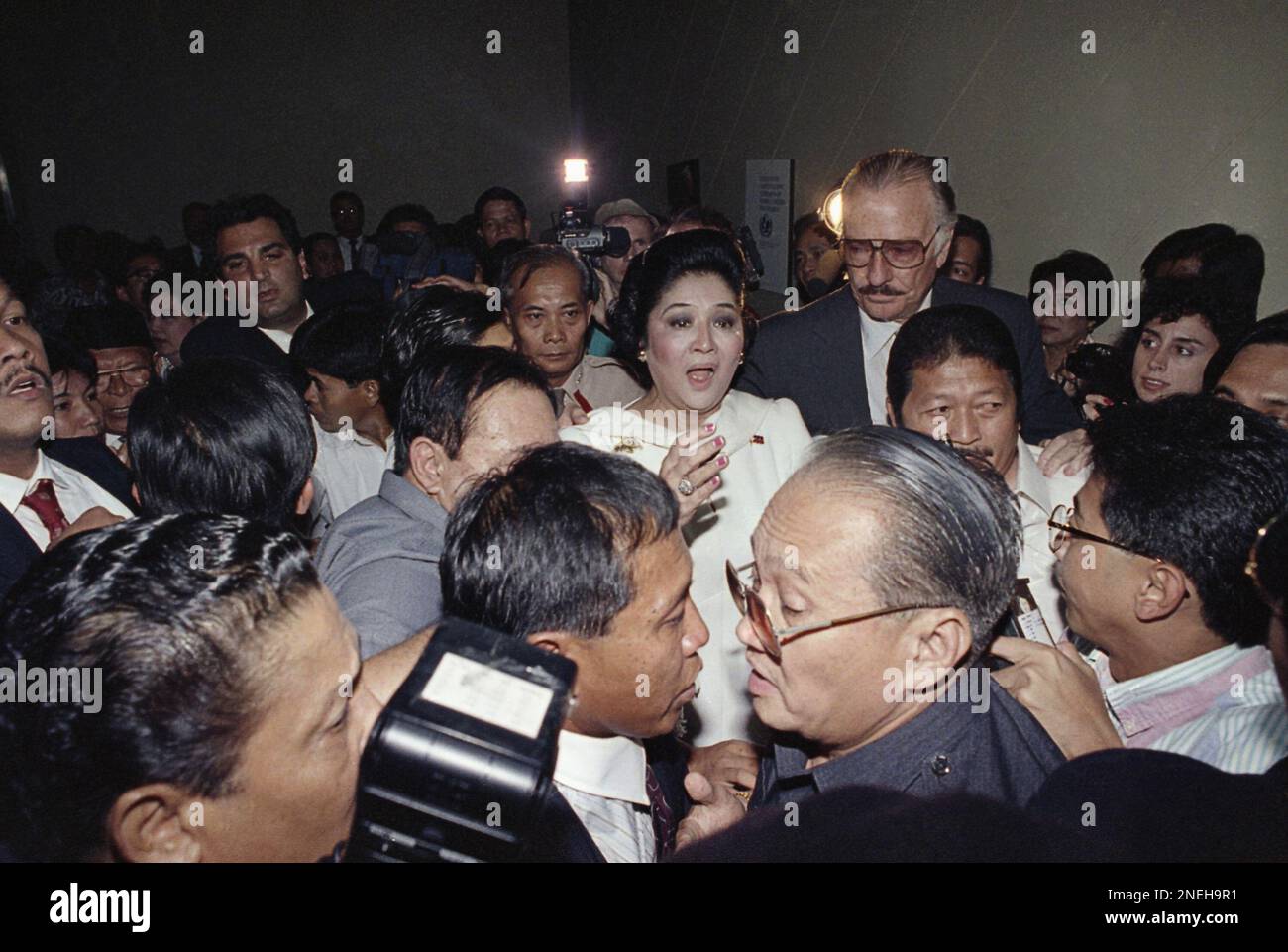 Former Philippines First Lady Imelda Marcos gestures to friends as she ...
