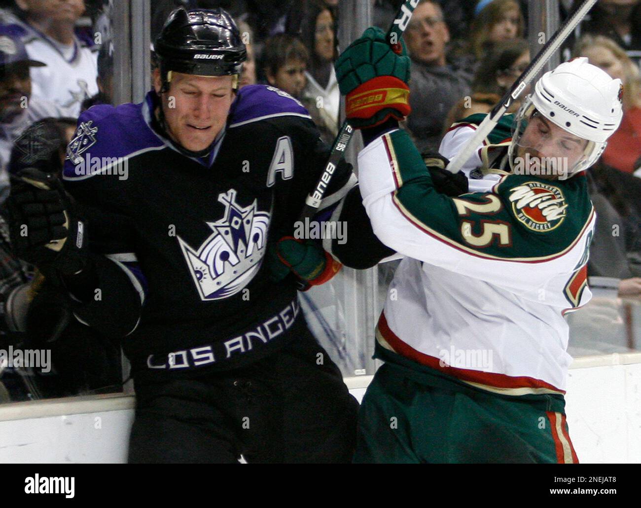 Minnesota Wild's Eric Belanger, right, checks Los Angeles Kings' Matt ...