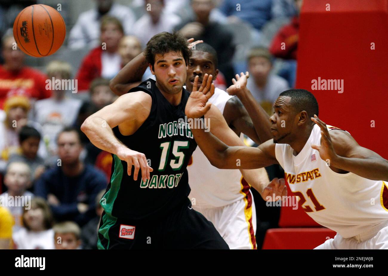 North Dakota's Travis Mertens (15) loses the ball in front of Iowa ...