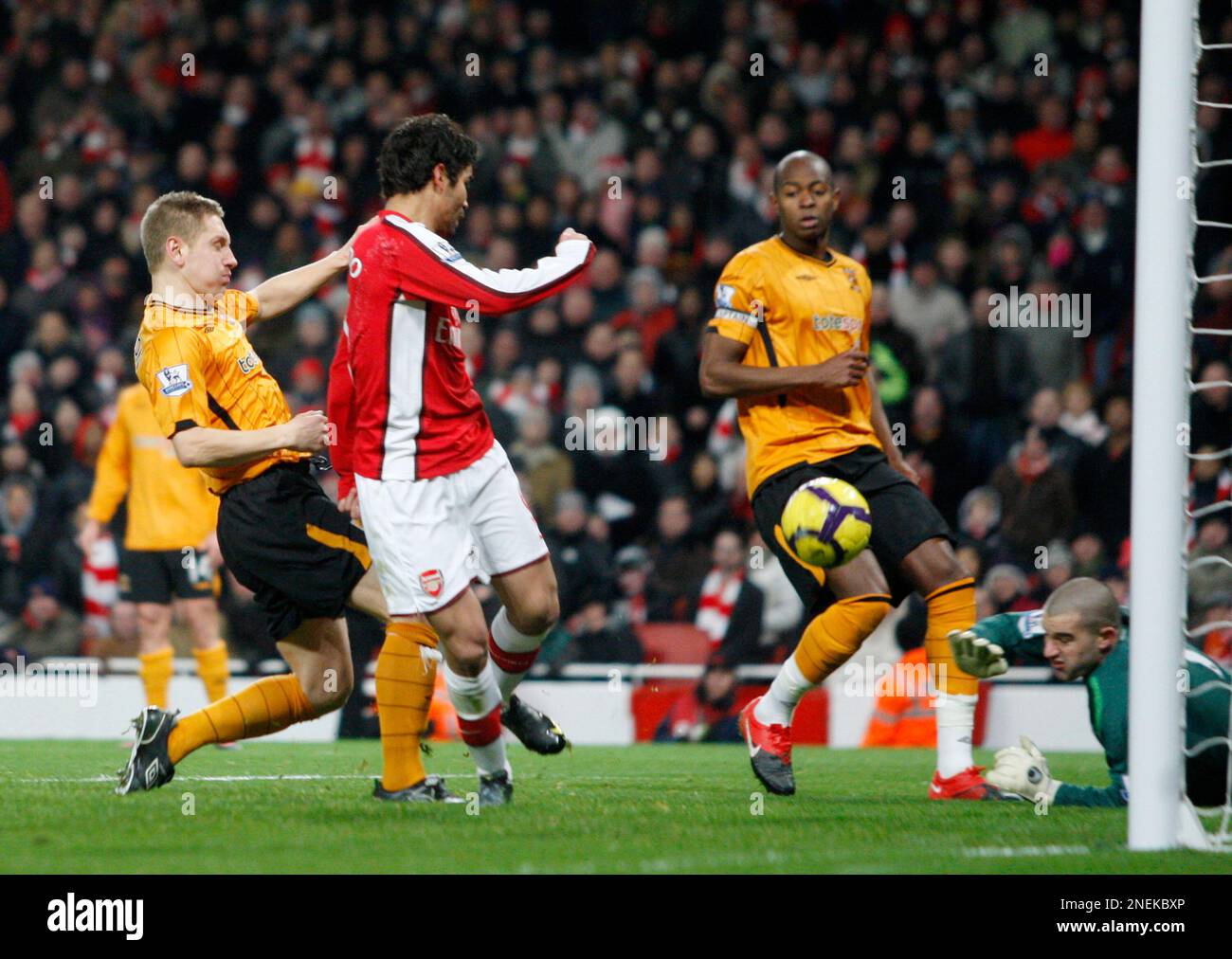 Arsenal's Eduardo, second from left, shoots past Hull City's goalkeeper ...