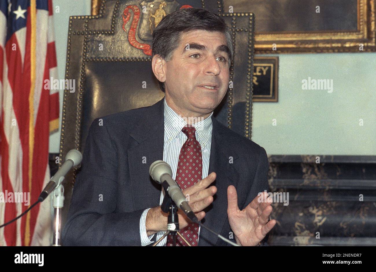 Massachusetts Gov. Michael S. Dukakis gestures in front of a chart ...