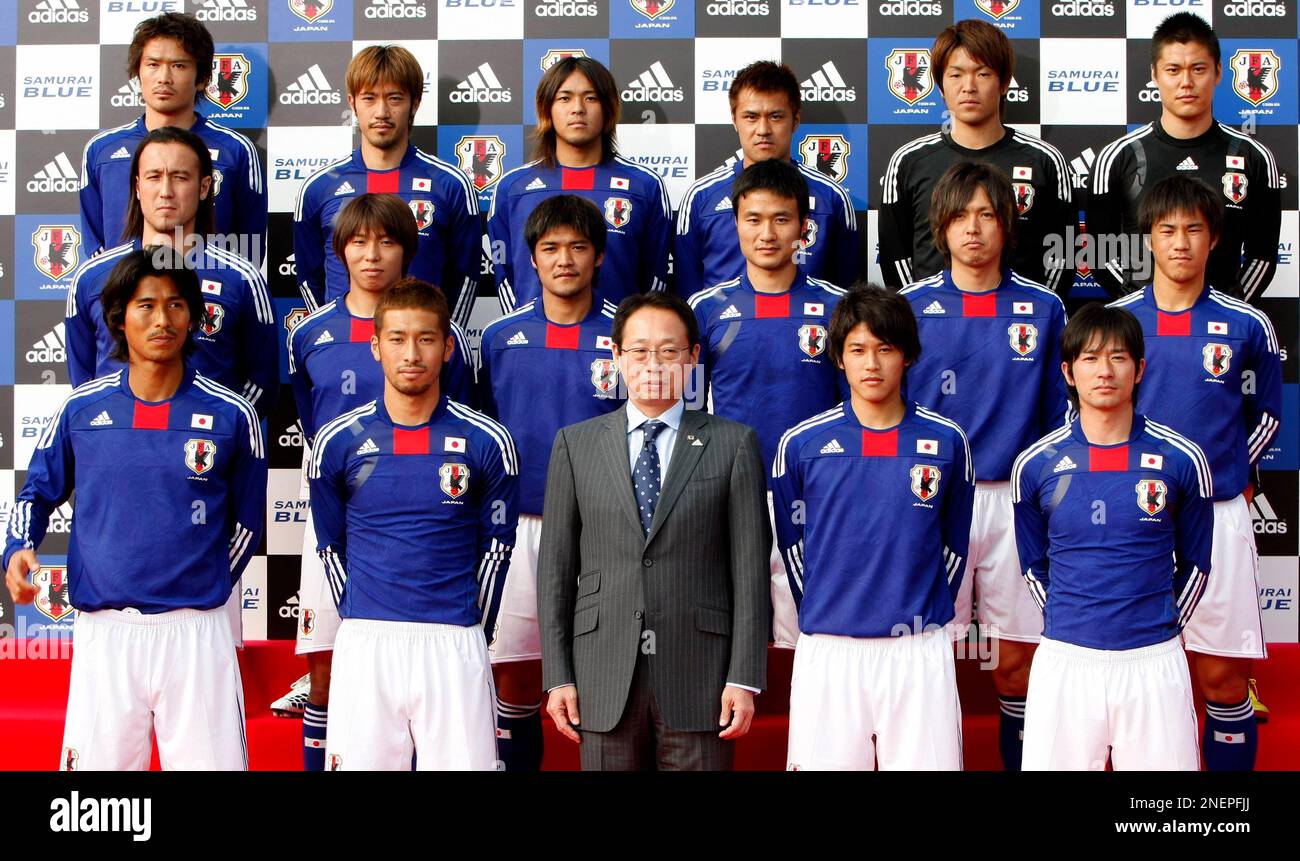 Members of Japan's national soccer team and coach Takeshi Okada ...