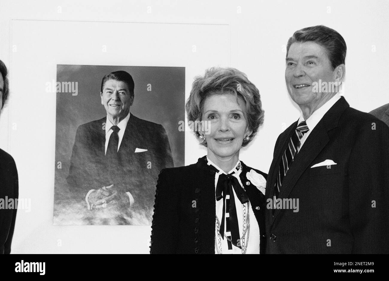 President Ronald Reagan stands with his wife, Nancy Reagan in front of ...